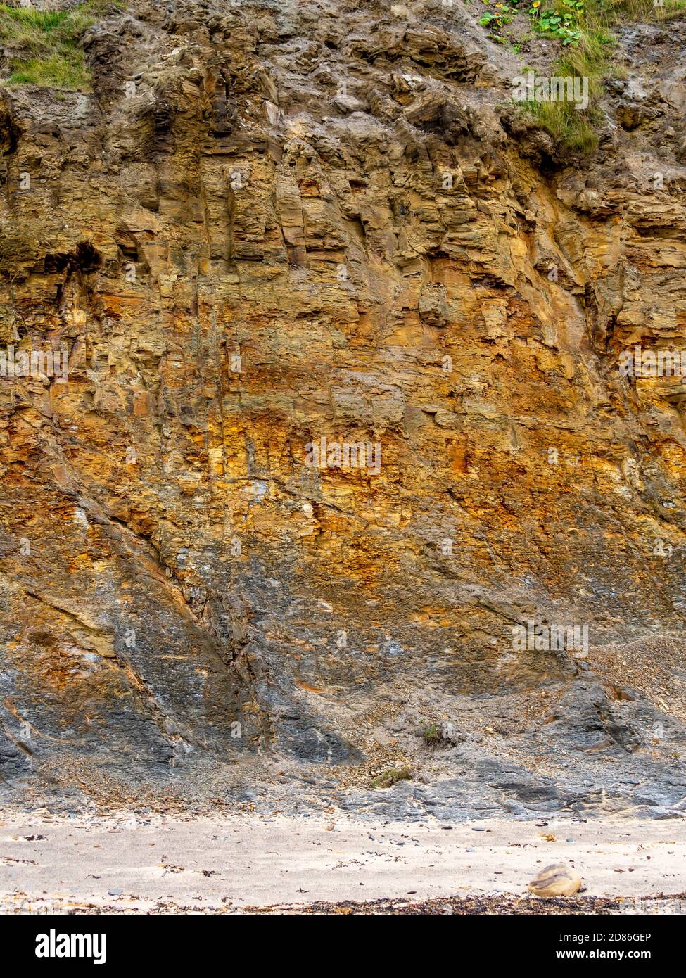Red Ironstone and Grey shale rock in cliff at Runswick Bay, North ...
