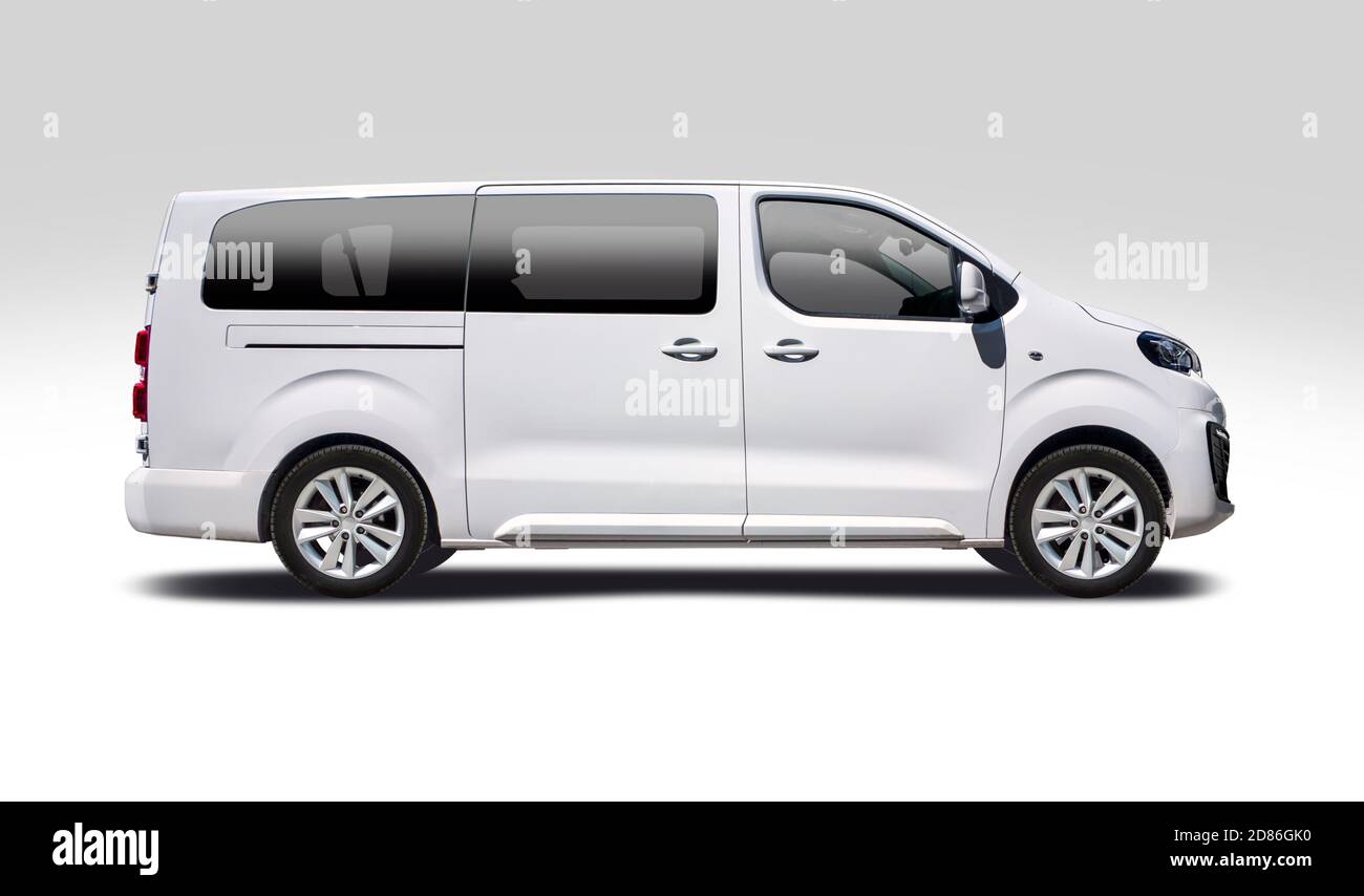 White mini bus side view isolated on white Stock Photo - Alamy