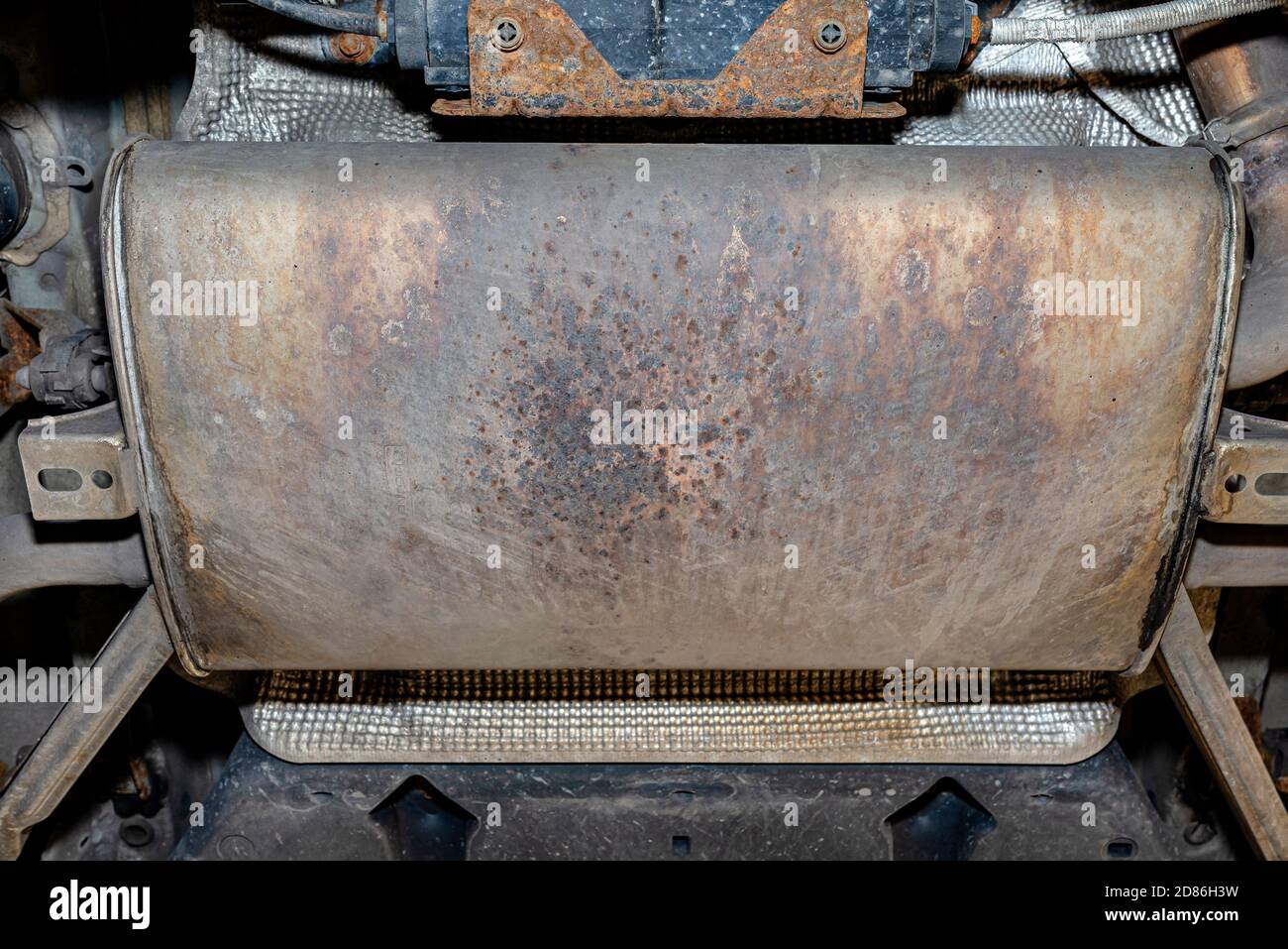 The exhaust system in the car seen from below, the car is on the lift ...