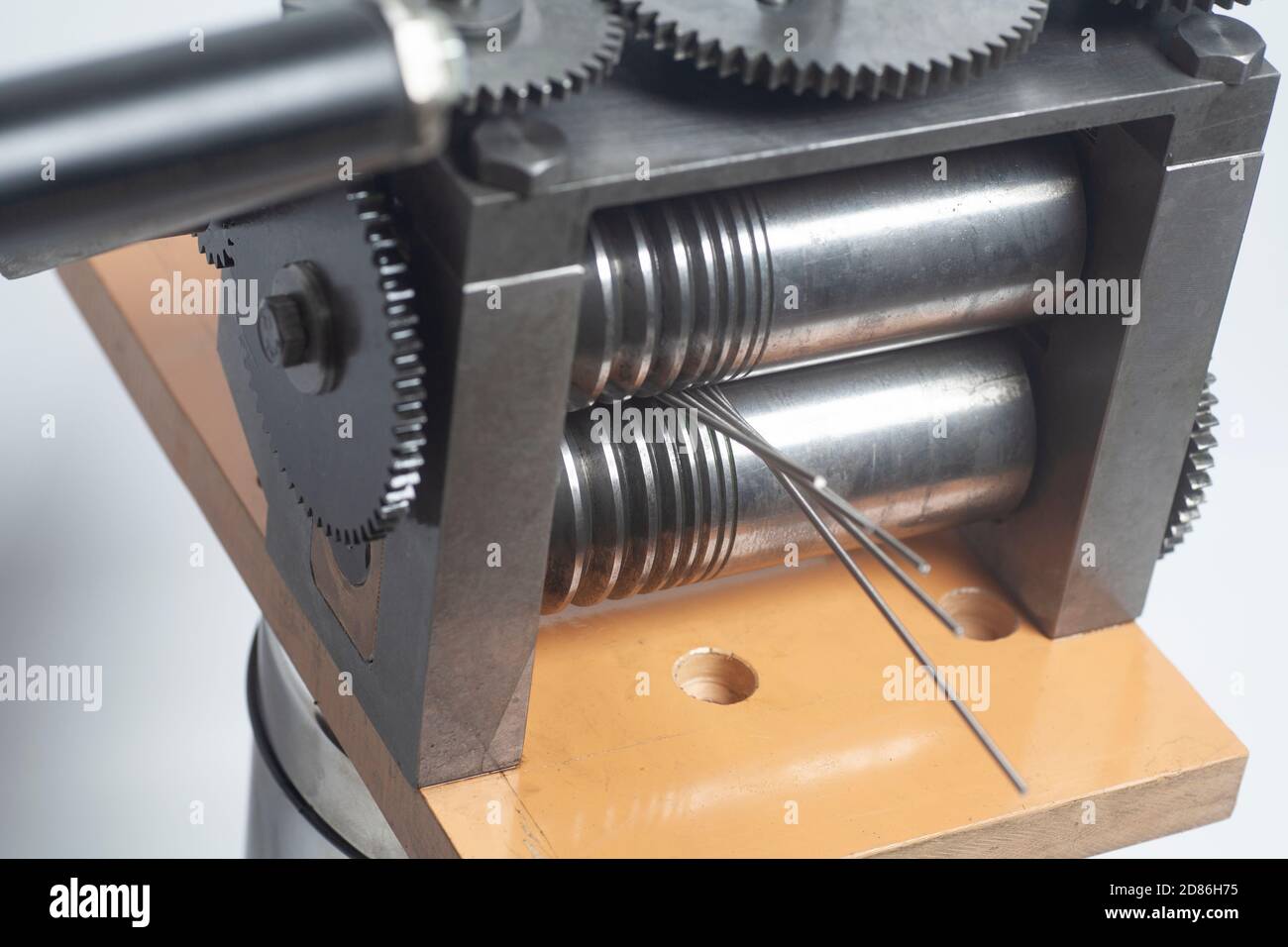 Jewelry rolling mill tool press rolling of a silver wire Stock Photo ...