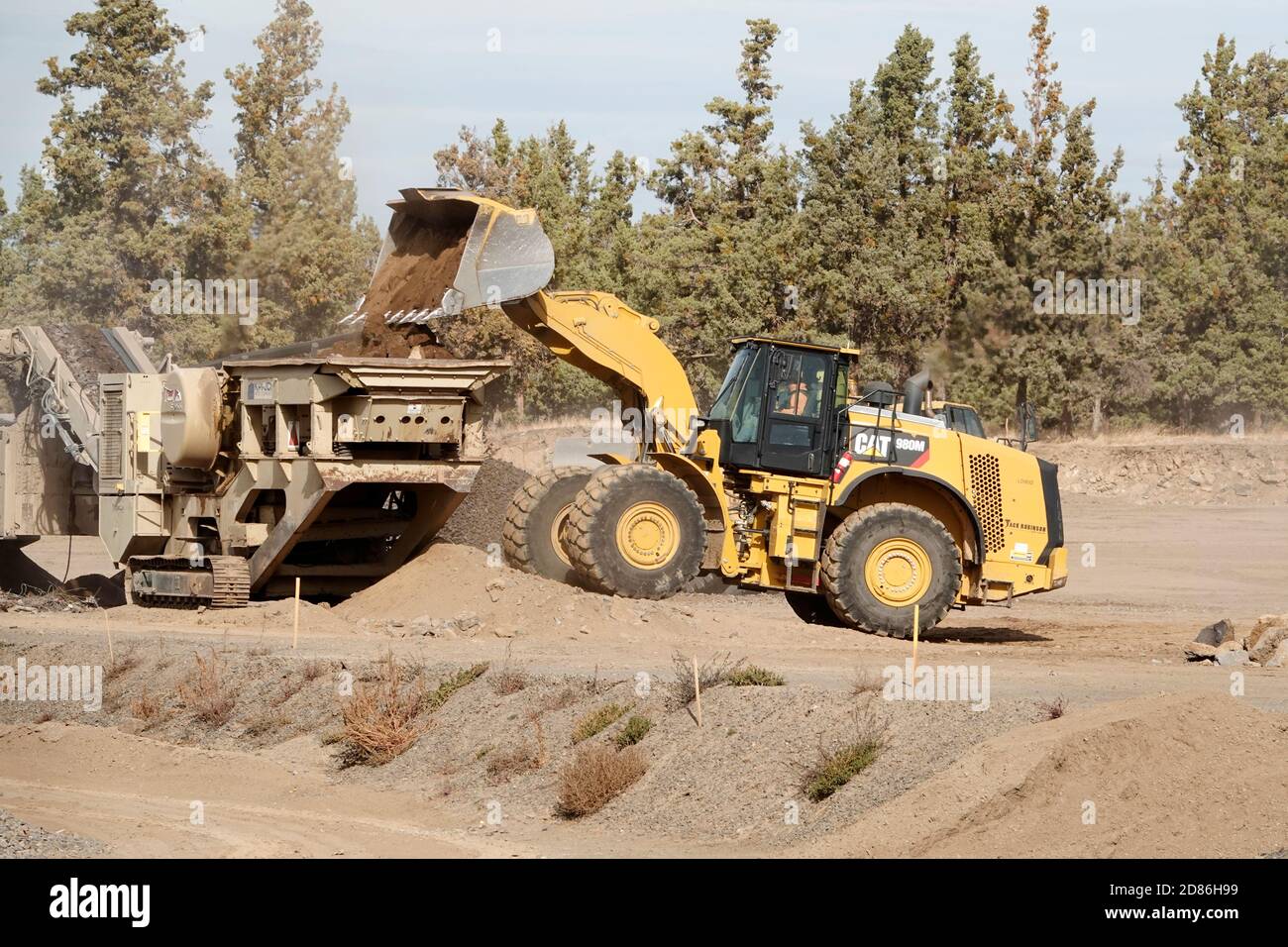 A large, earth moving tractor on a construction site in Bend, Oregon ...