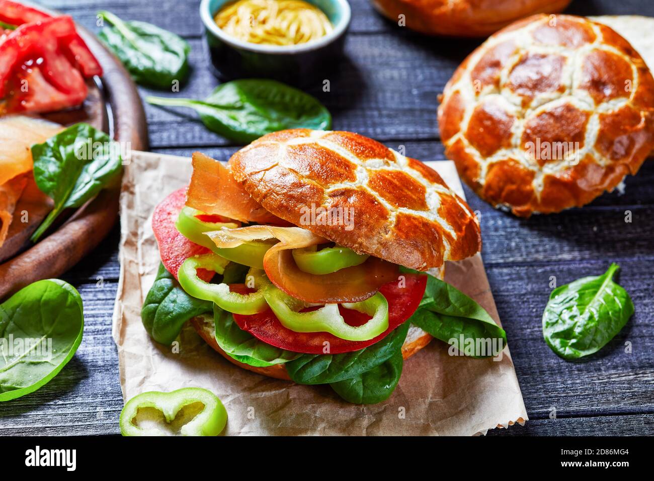 Fish burgers of chinese pineapple buns with spinach, sweet pepper ...