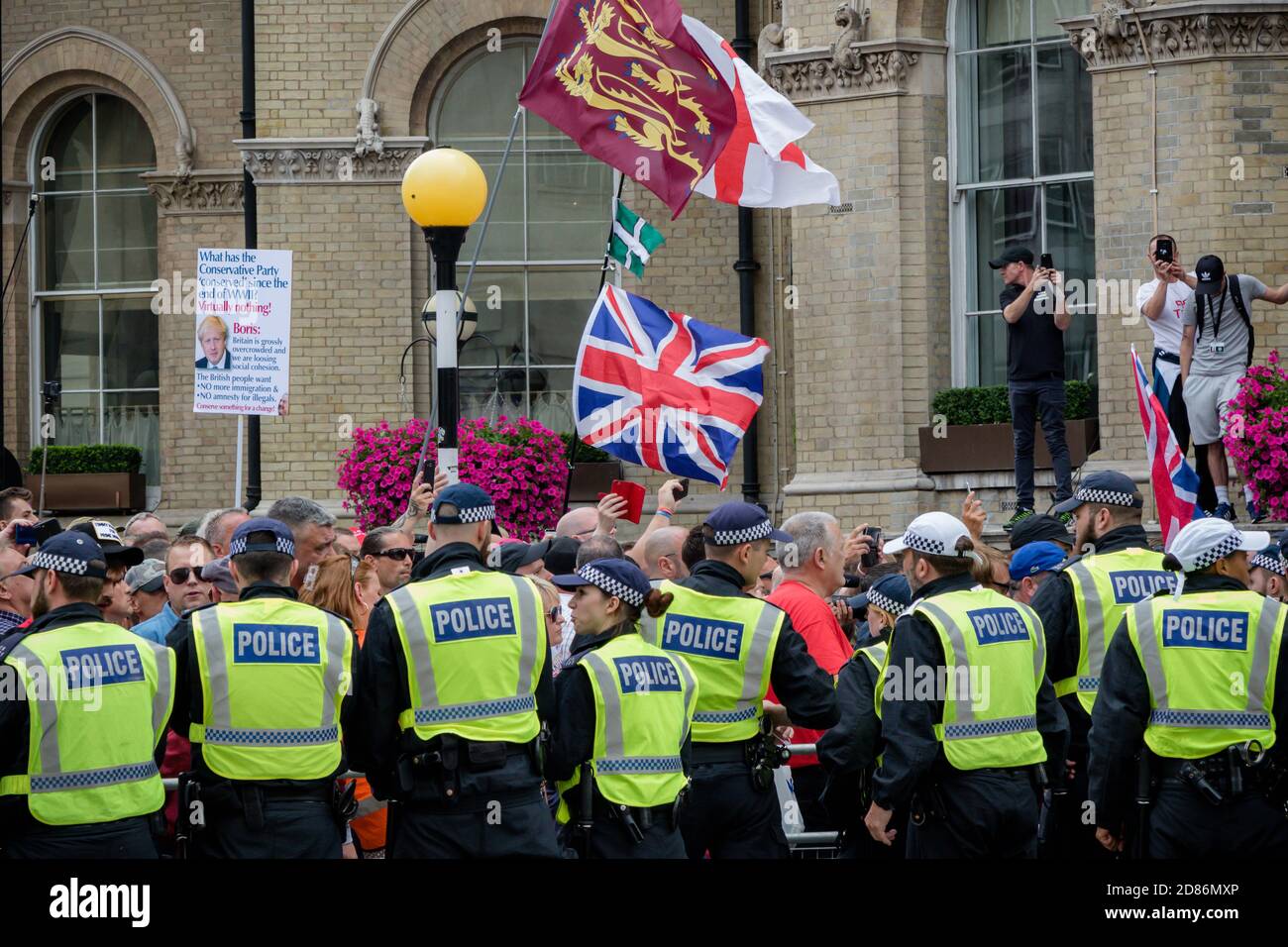 London, United Kingdom, August 3rd 2019:- Police form a line to control ...