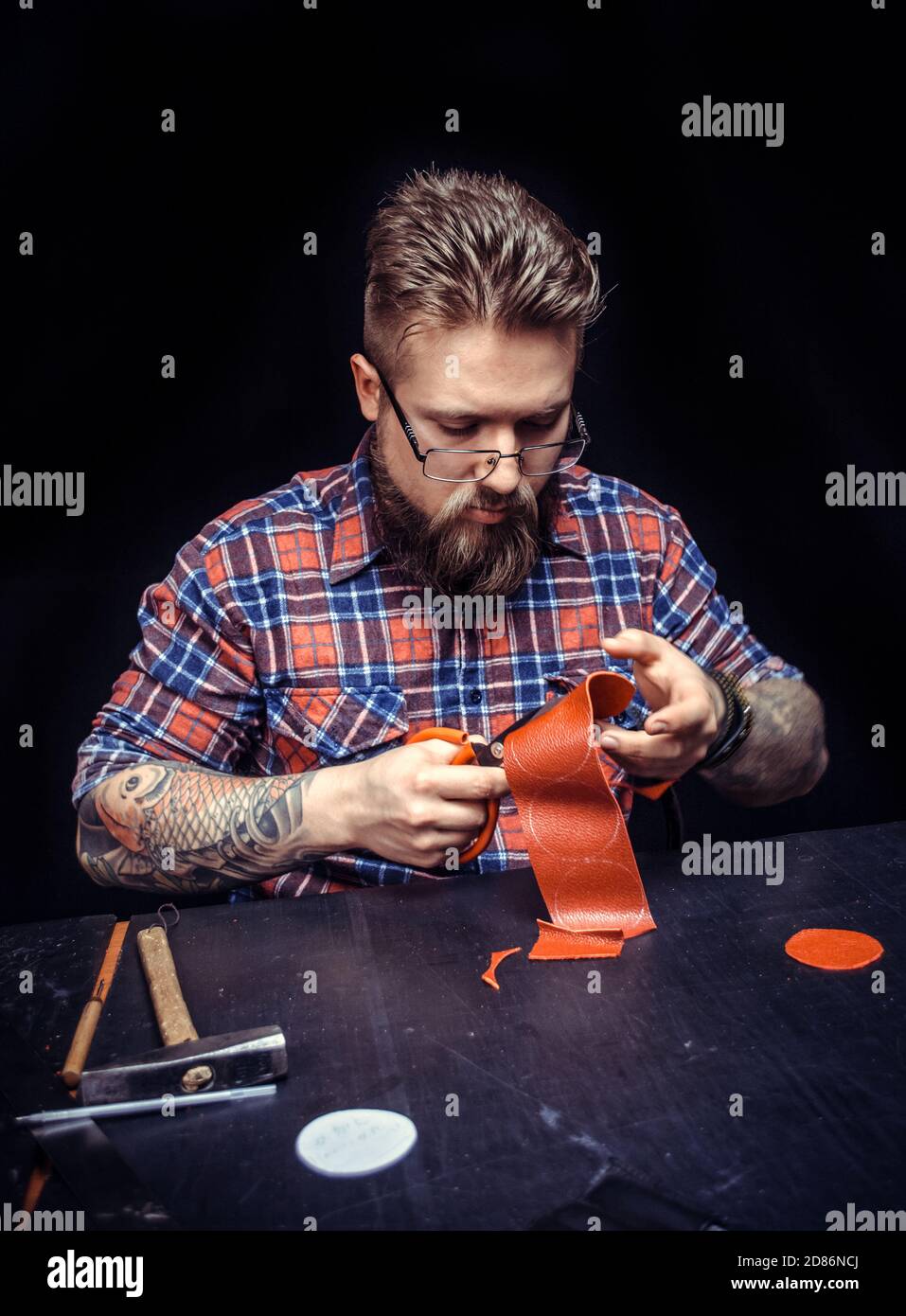 Currier of leather produces a good product Stock Photo - Alamy