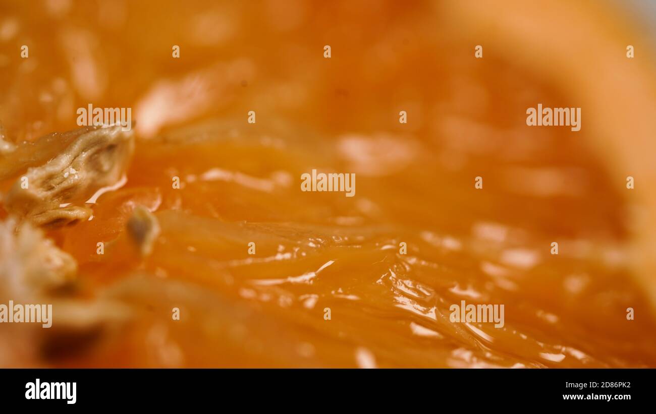 Orange slice juice inside pulp macro Stock Photo - Alamy