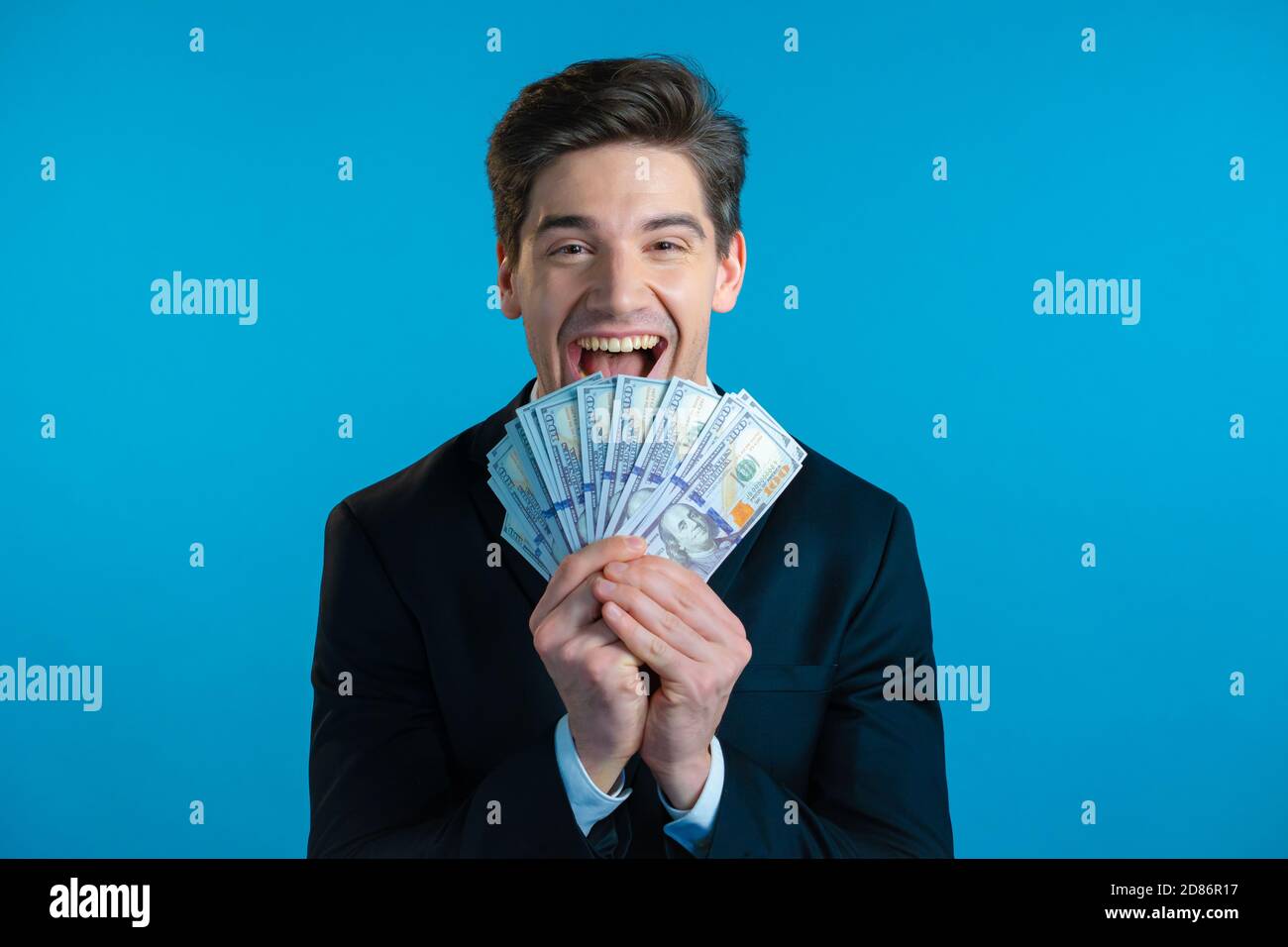 Portrait casual man counting dollars hi-res stock photography and ...