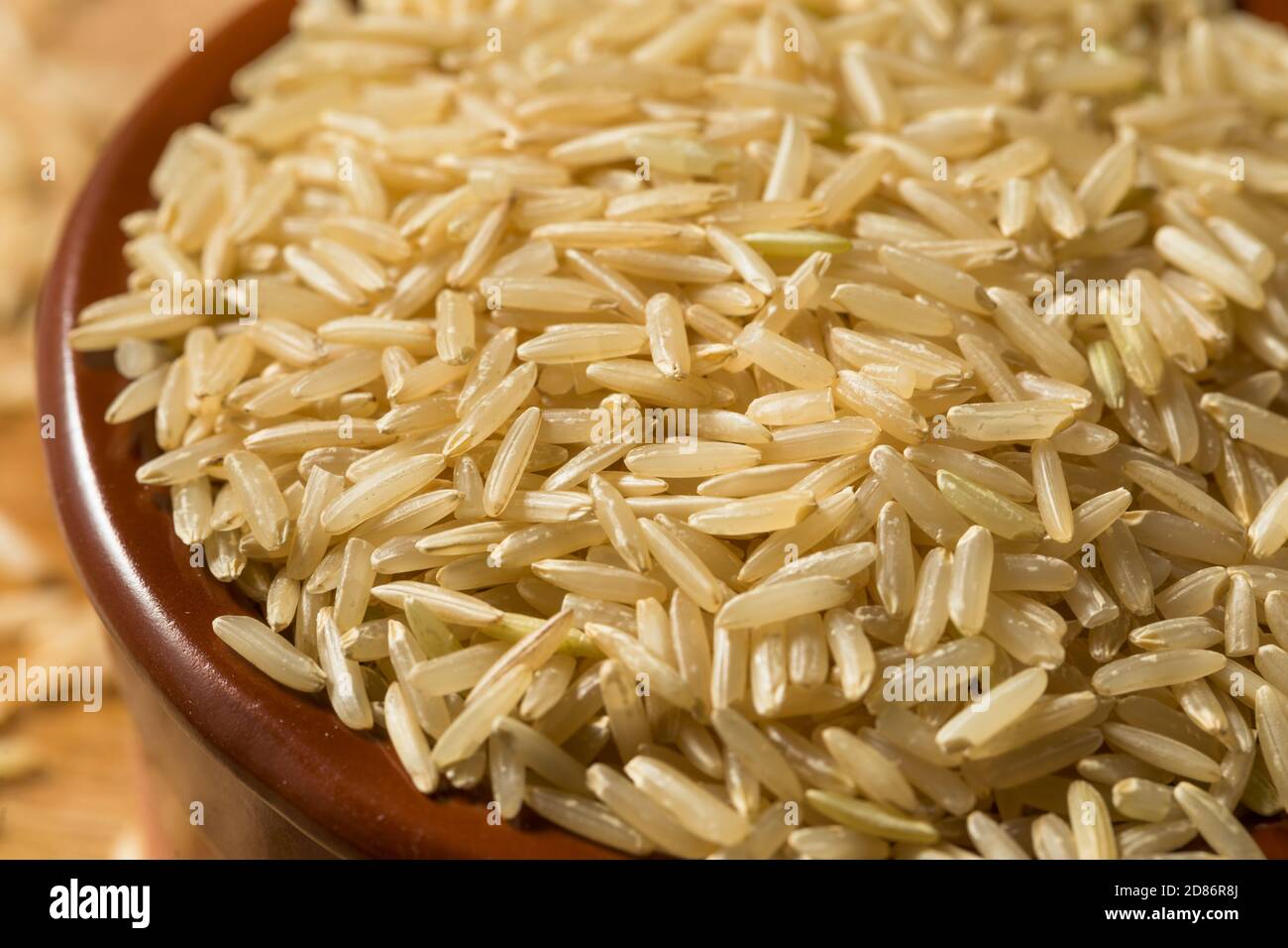 Dry Organic Brown Rice in a Bowl Stock Photo - Alamy