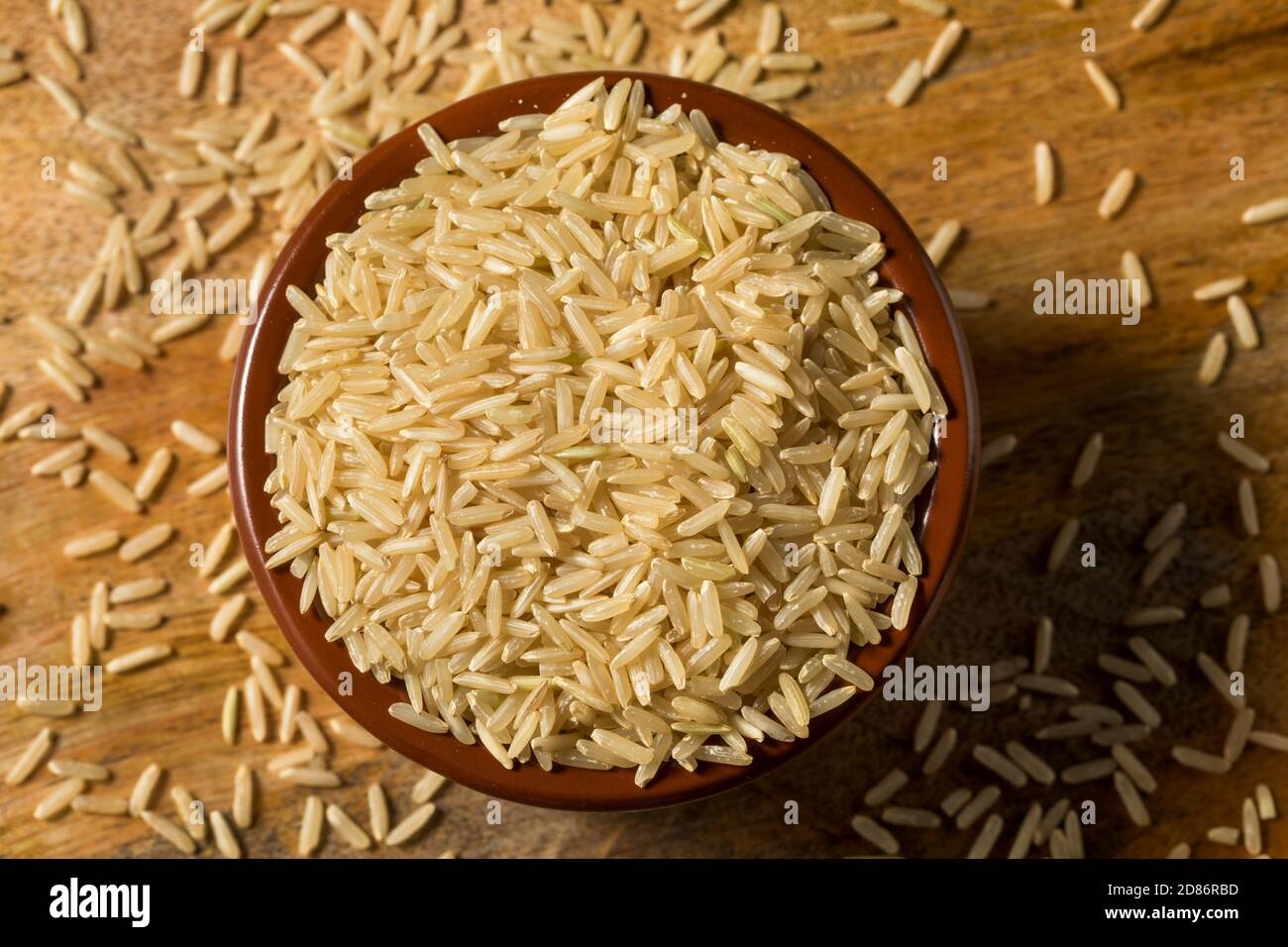 Dry Organic Brown Rice in a Bowl Stock Photo - Alamy