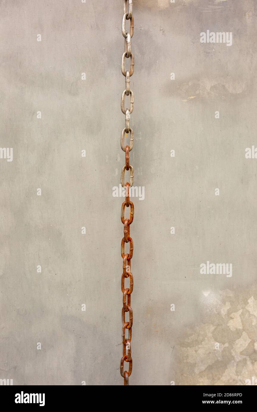 Iron chain in a wall Stock Photo - Alamy