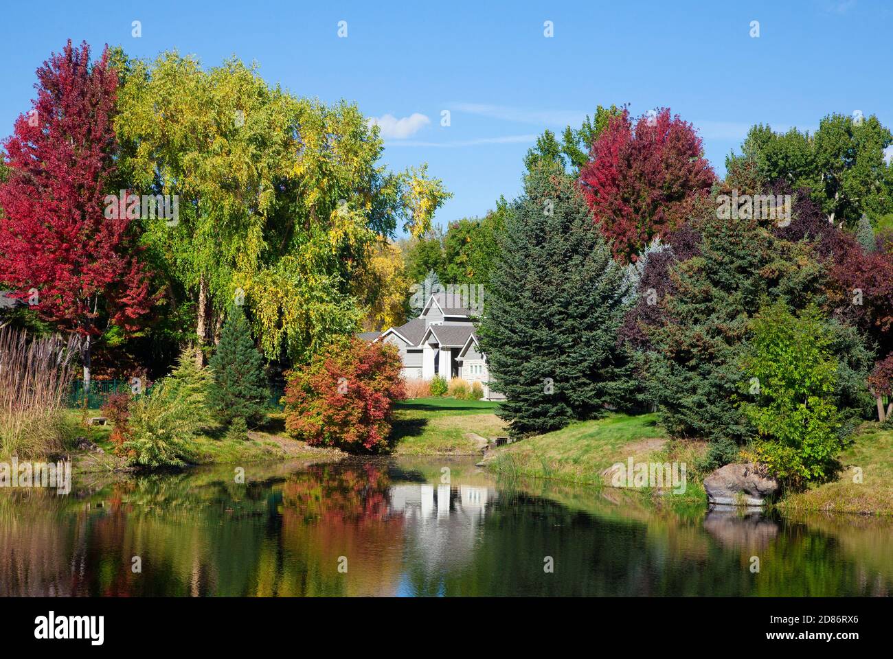Country home on pond in autumn, 2020 Stock Photo - Alamy