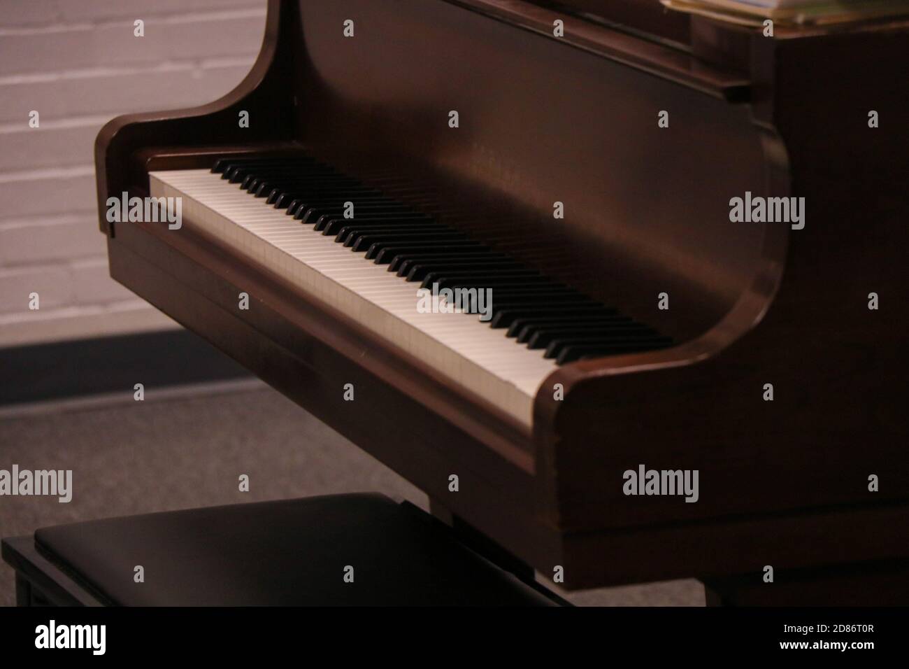 Piano sitting in the music room Stock Photo - Alamy