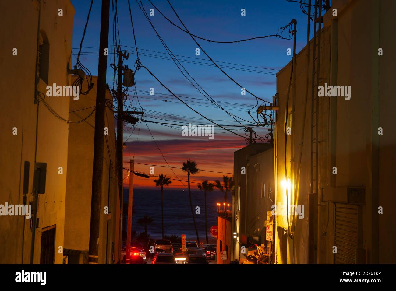 Evening light and sky colors between two urban buildings with messy ...