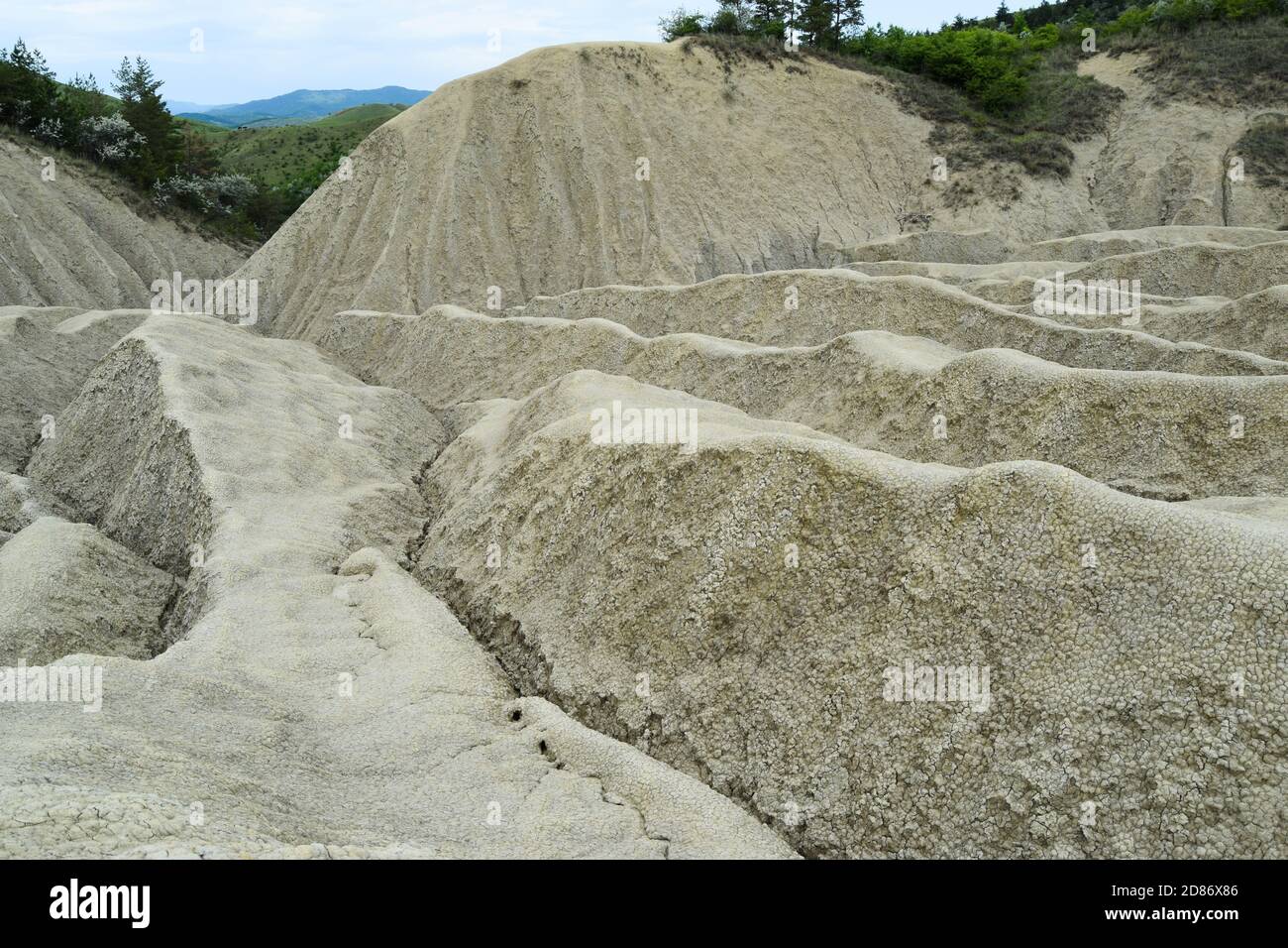 Landscape with cracked soil from Mud Volcanoes, at Paclele Mari ...