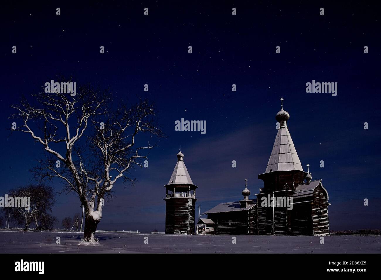 Wooden ancient temple at night in winter on a tree background Stock ...