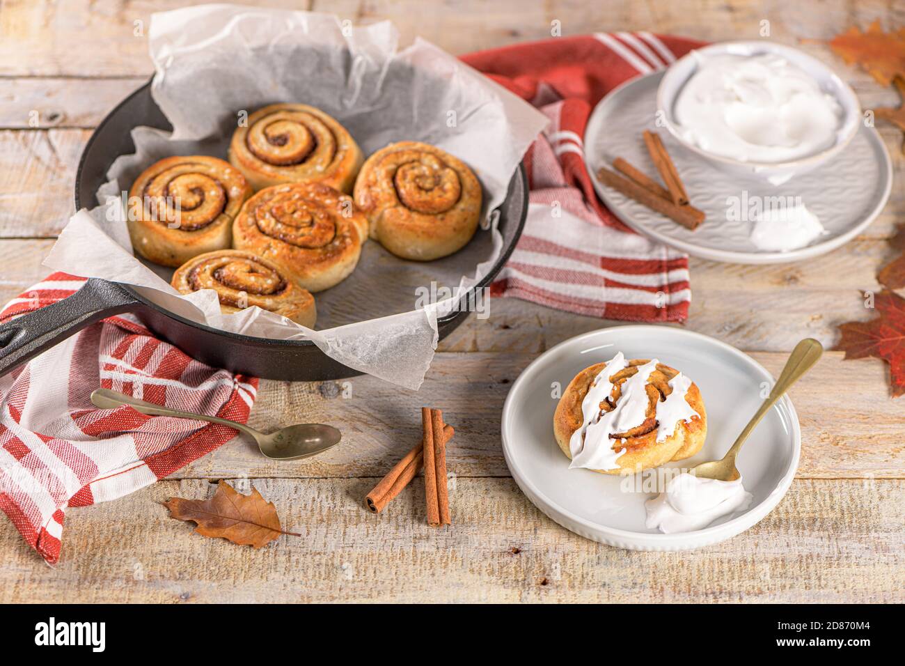 Cinnamon buns with chocolate chips baked in a cast iron pan overhead ...