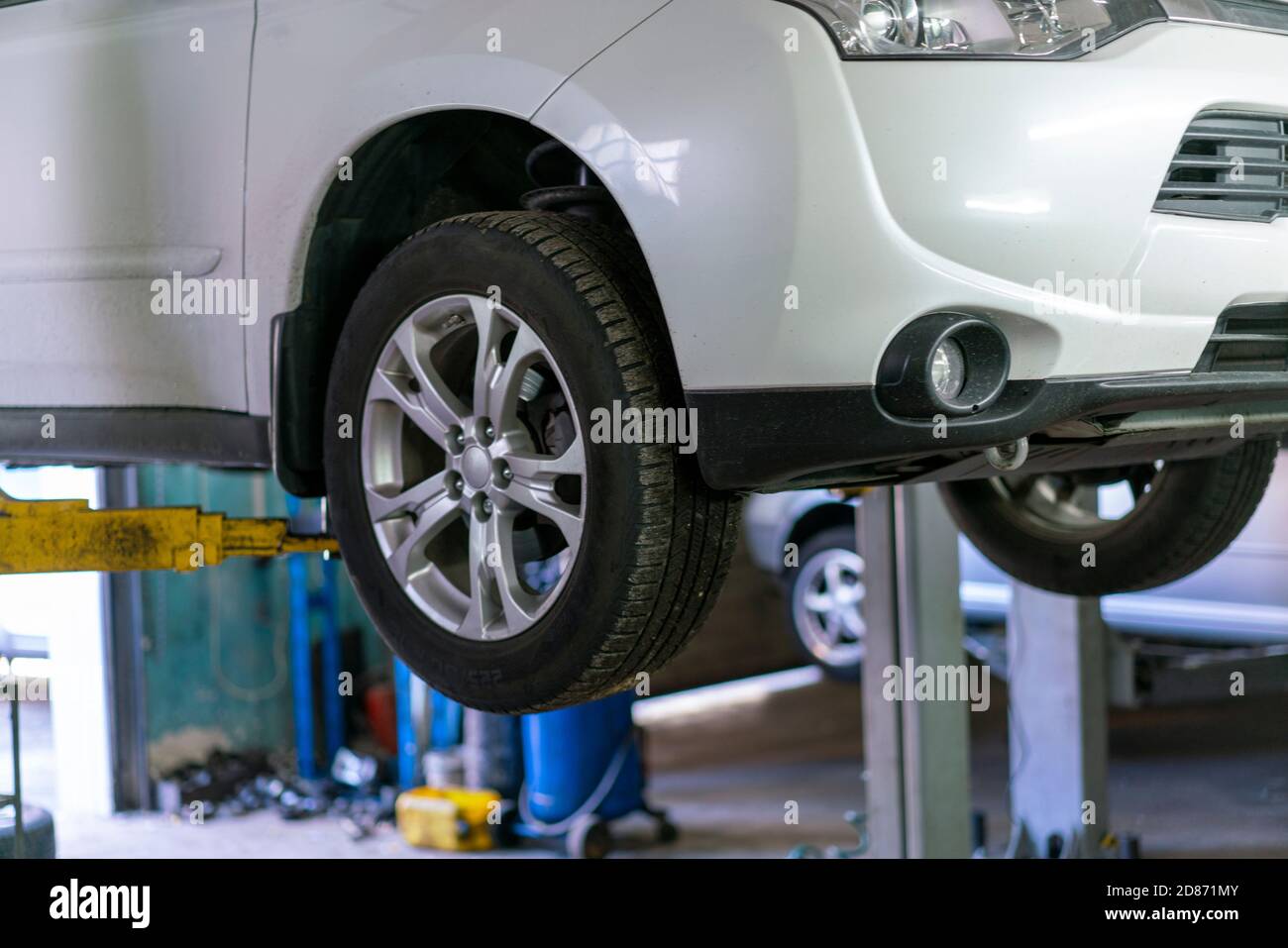 Car lifted up in service station hi-res stock photography and images ...