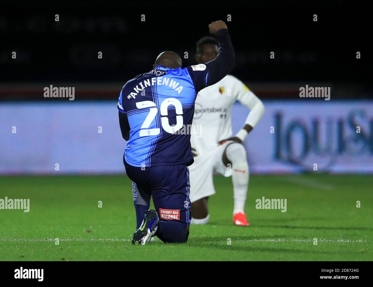 Wycombe Wanderers' Adebayo Akinfenwa takes a knee in support of the ...