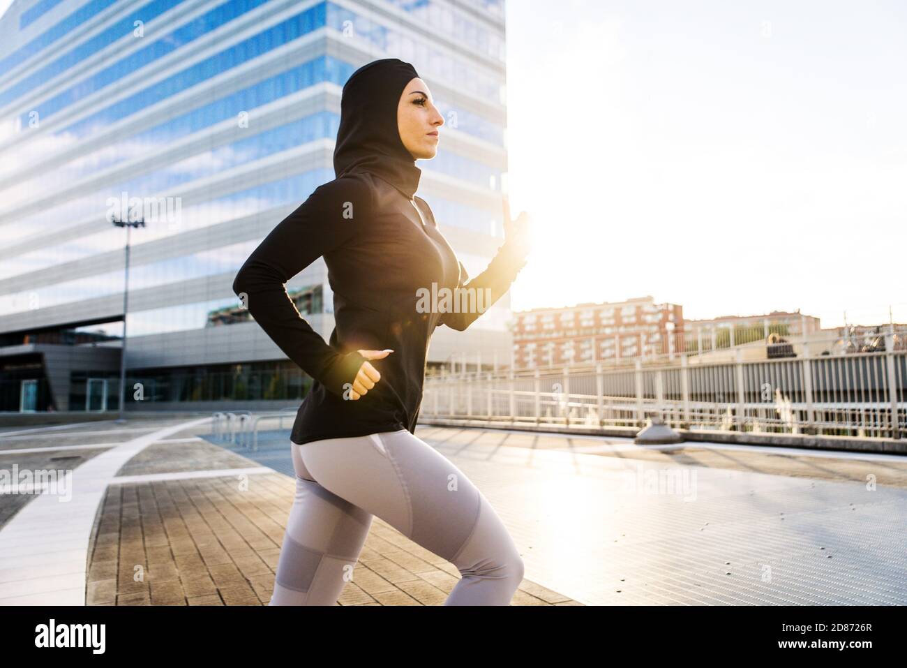 Muslim sportive girl with fit body training outside - Beautiful woman ...