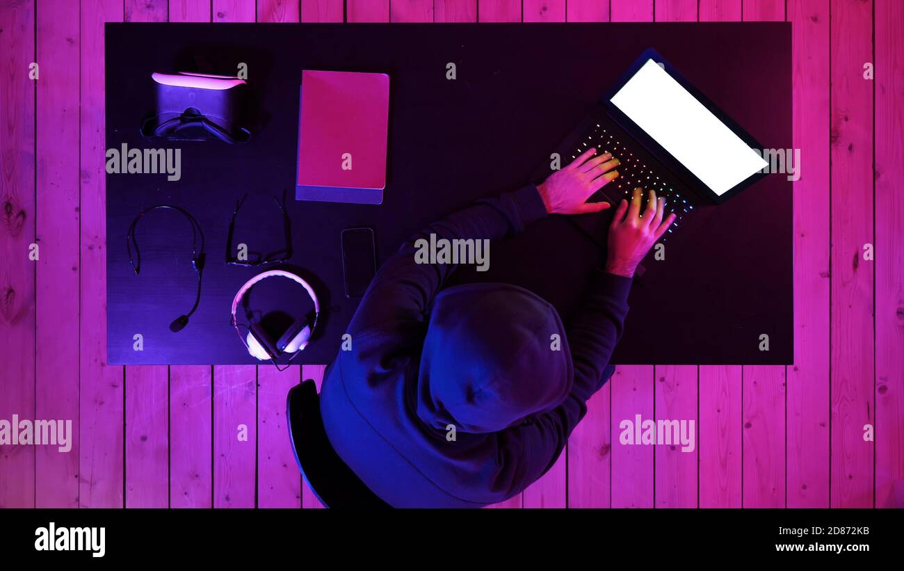 Cybercrime, hacking and technology concept - male hacker in dark Stock ...