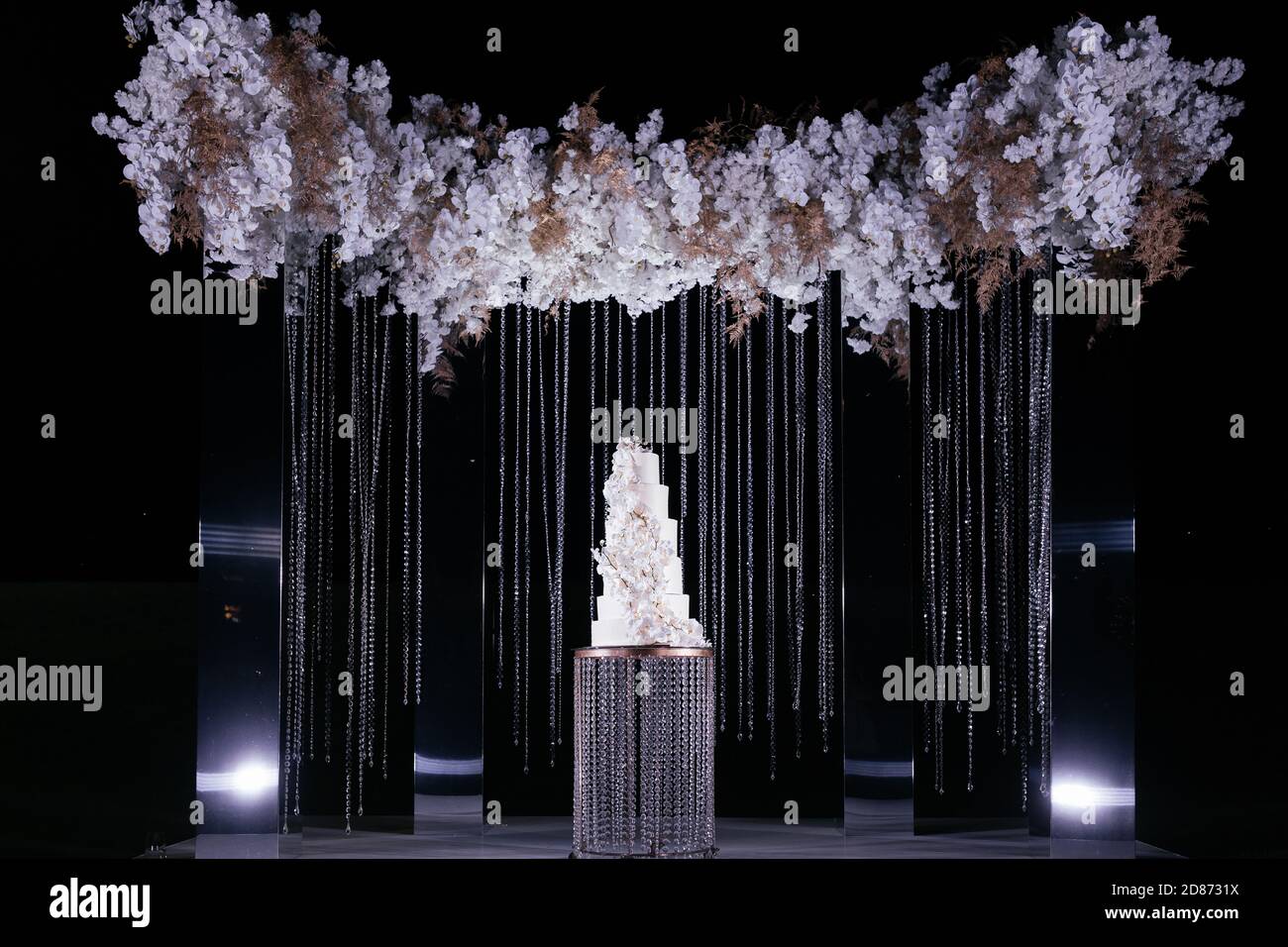 Big wedding cake on the round table. Wedding cake Wedding cake at the ...