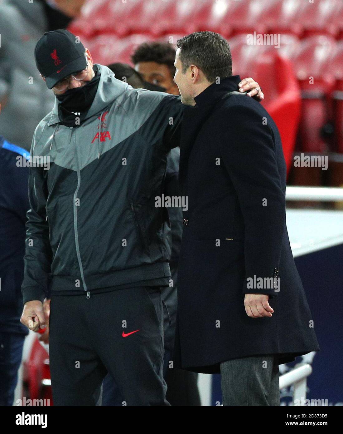 Liverpool manager Jurgen Klopp (left) greets FC Midtjylland head coach ...