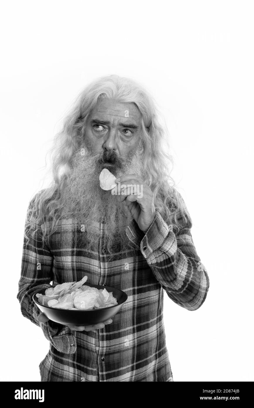 Man eating potato chips Black and White Stock Photos & Images - Alamy