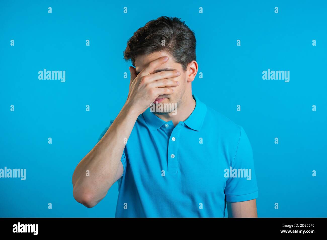 Portrait of young man doing facepalm gesture, like no, I forgot ...