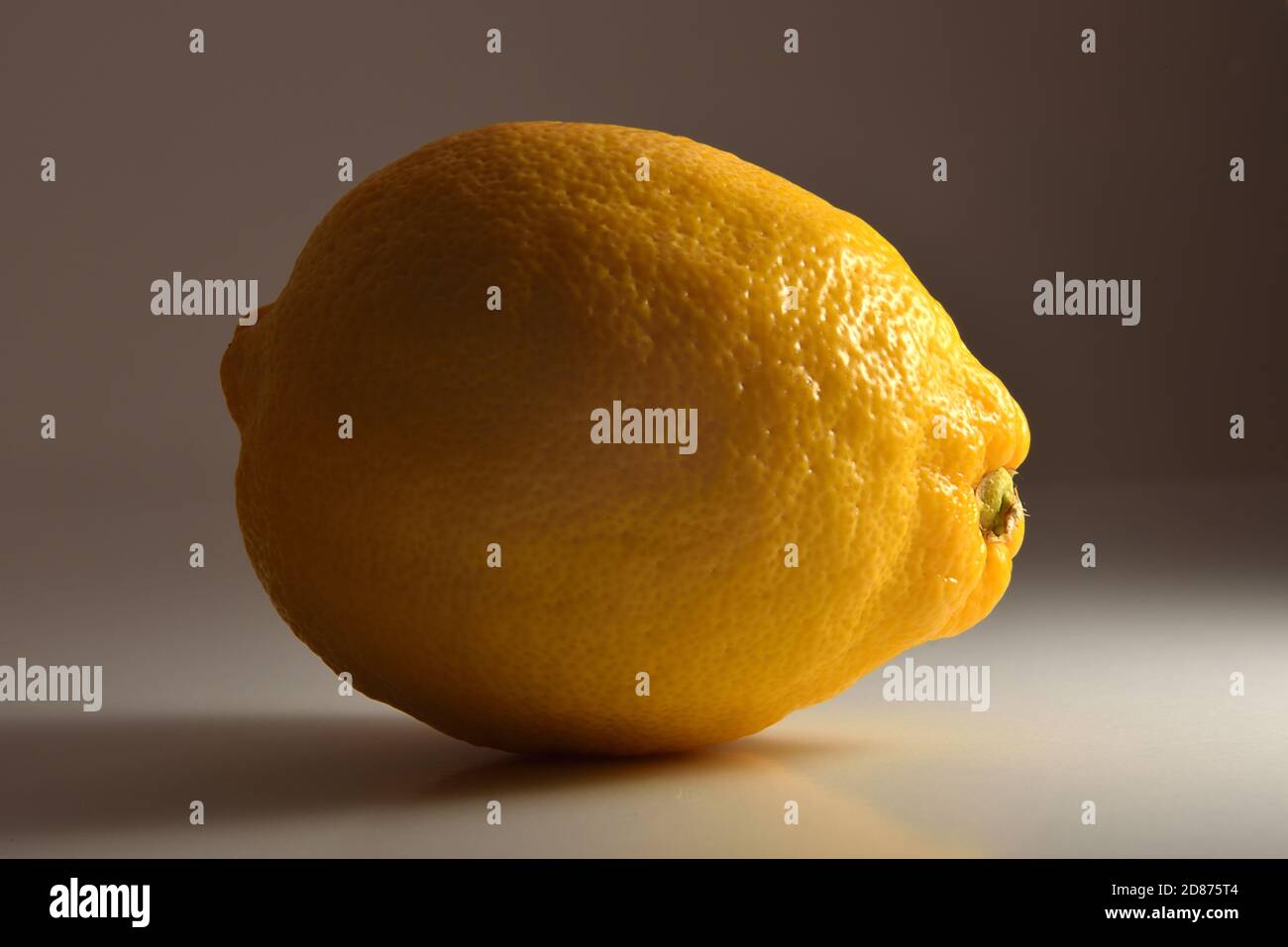 Lemon piece on white base gray isolated background. Horizontal ...