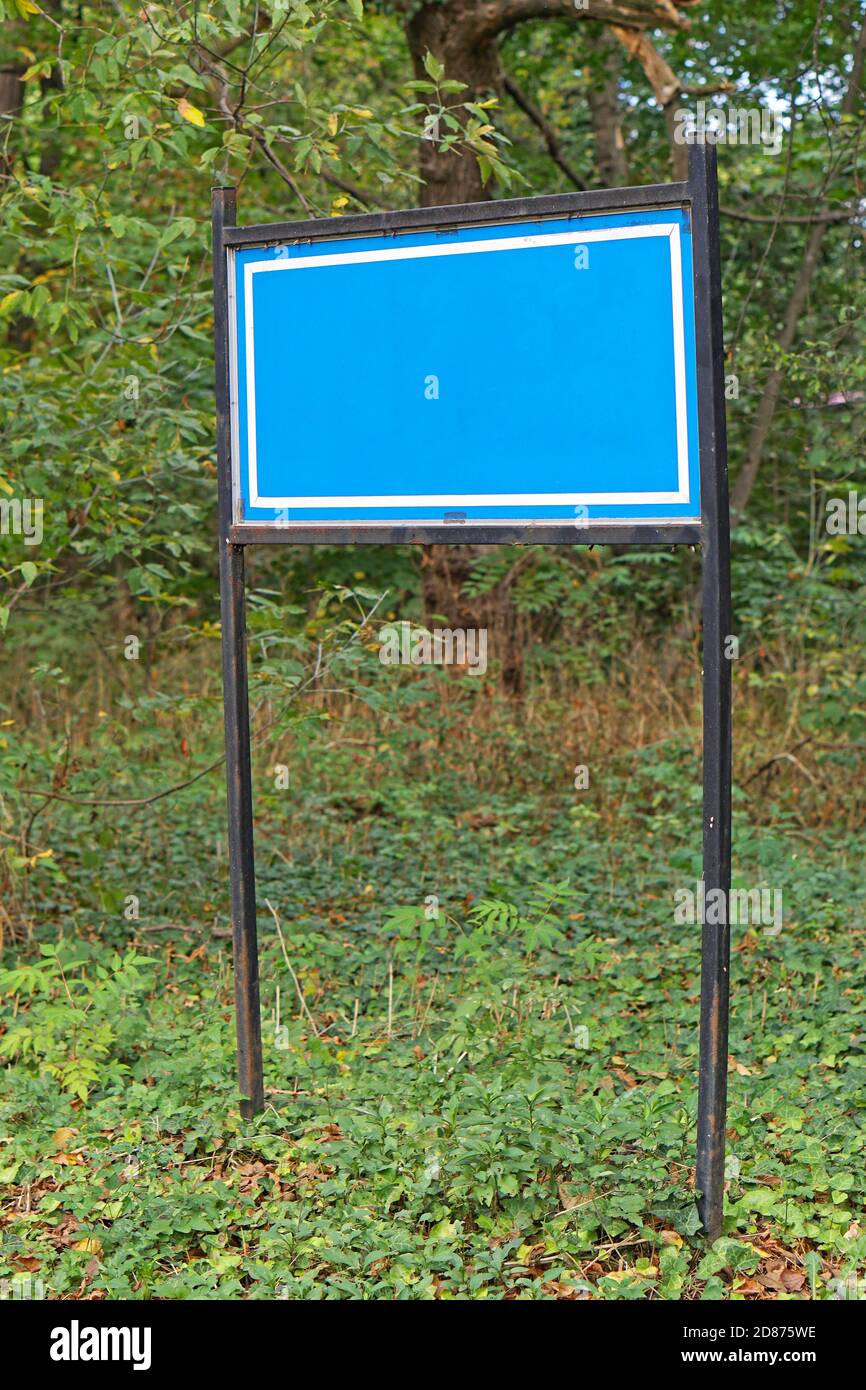 Empty space blue information board in woods Stock Photo - Alamy
