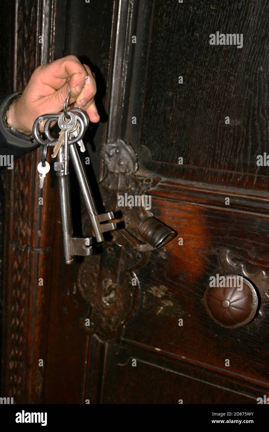 Old keys opening a church door in Romania Stock Photo - Alamy