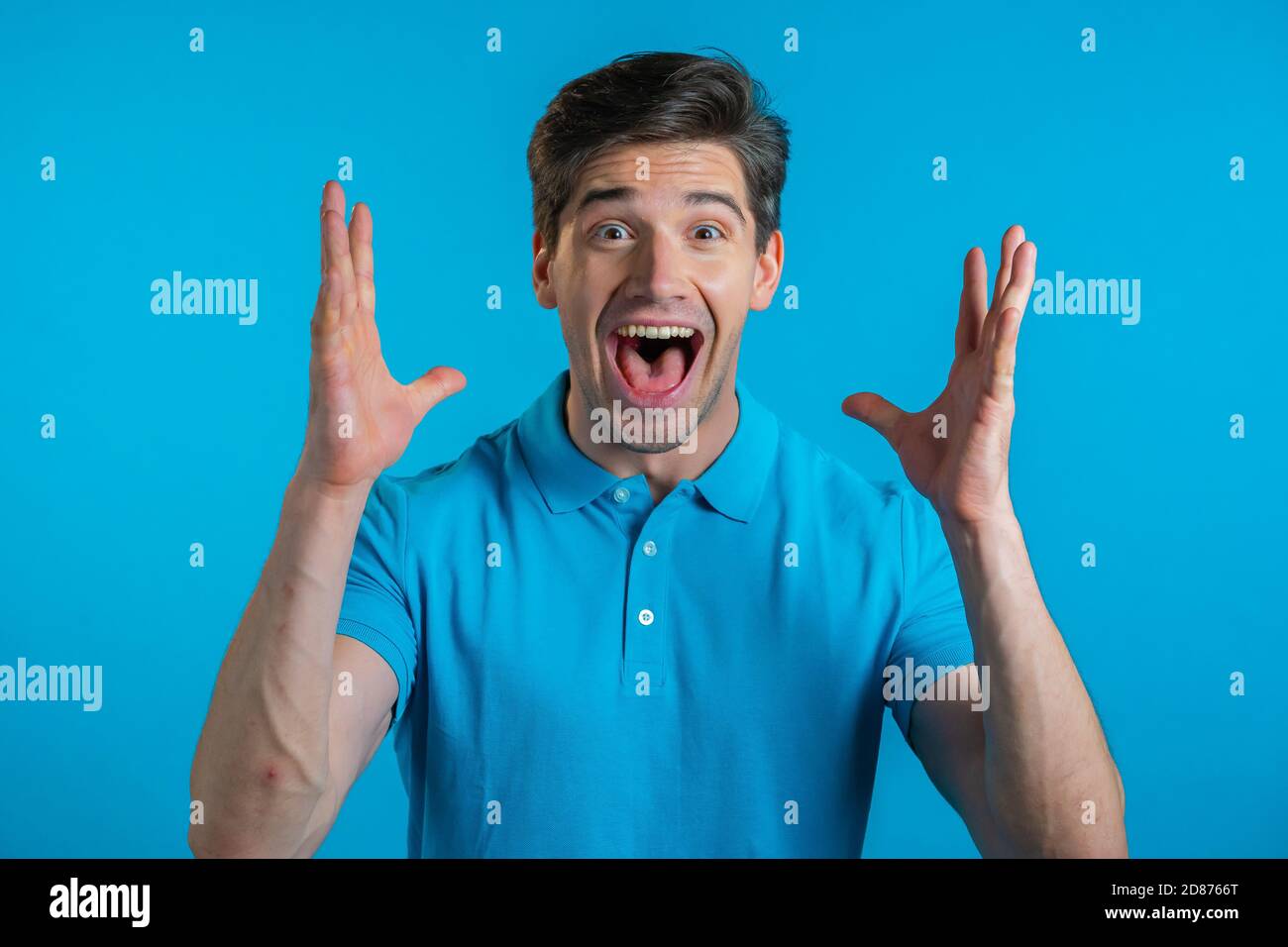 Man depicts amazement, shows WOW delight face effect. Surprised excited ...