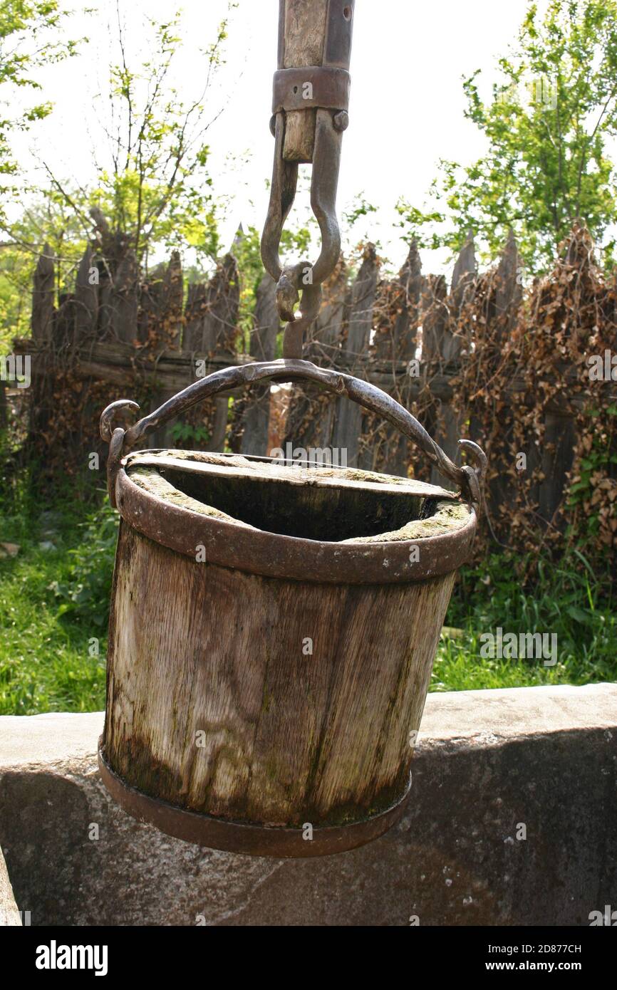 Traditional water well bucket in a village in Romania Stock Photo - Alamy