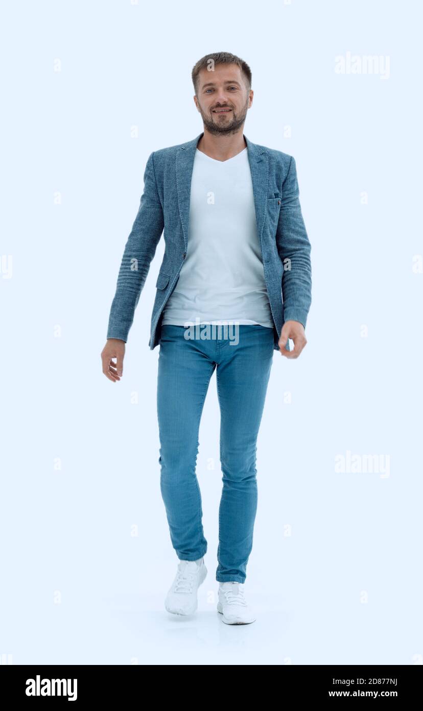 in full growth. confident young man striding forward Stock Photo - Alamy
