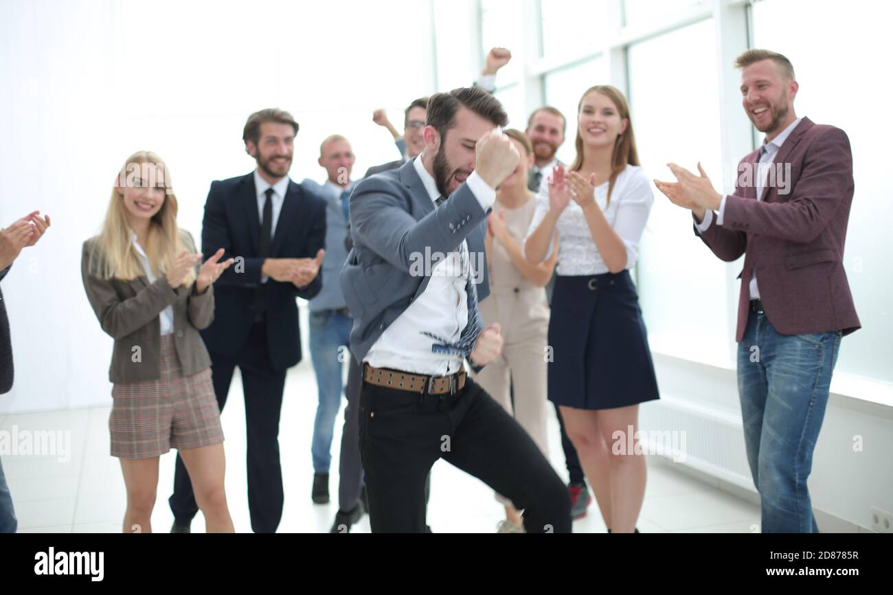 jubilant group of employees meeting the boss of the winner Stock Photo ...