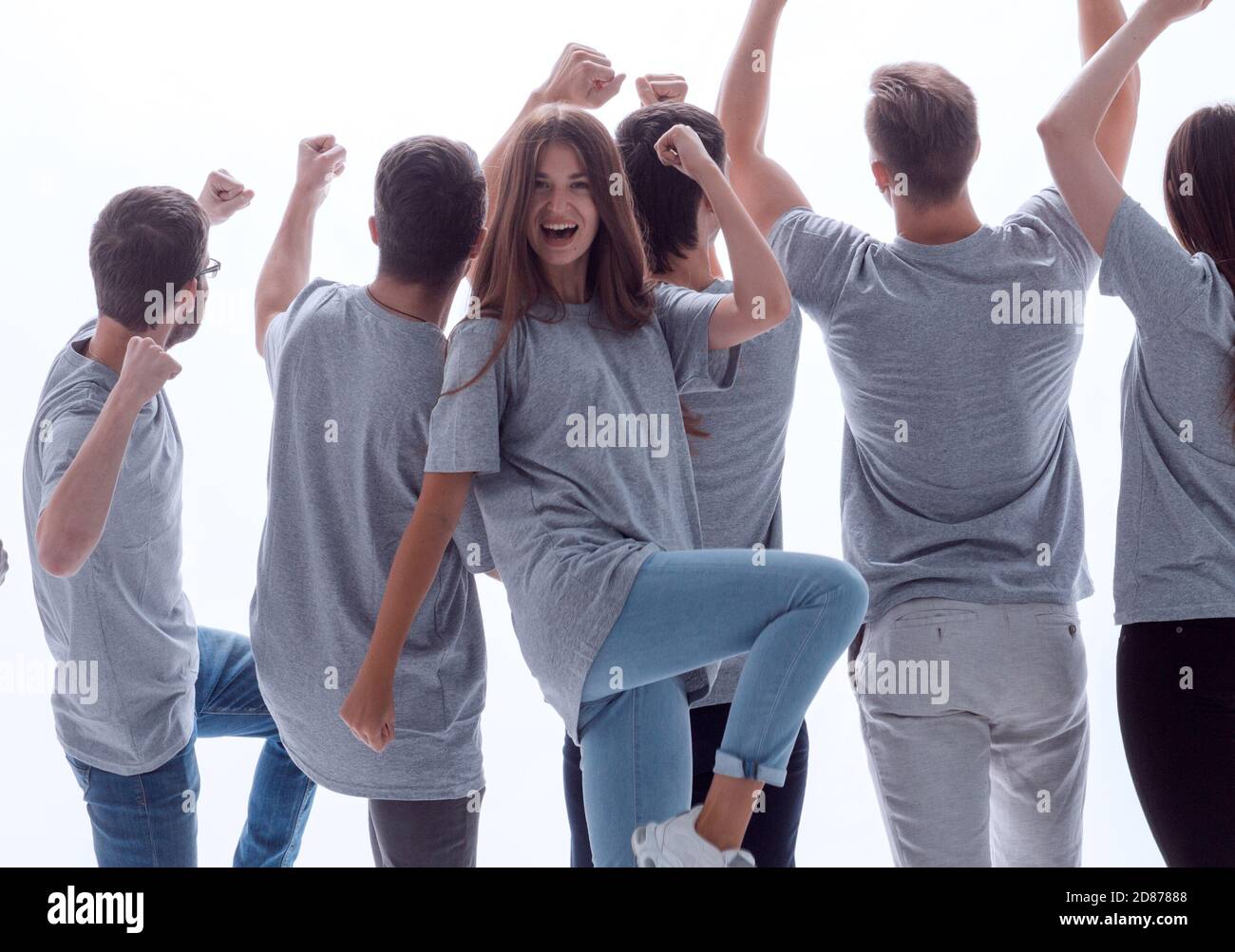 rear view. a group of happy young people looking forward Stock Photo ...