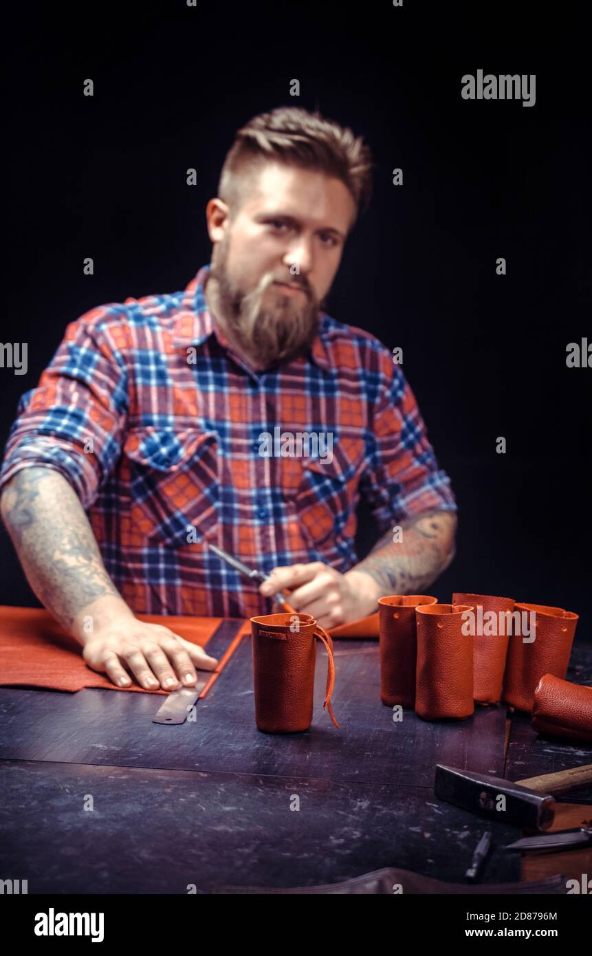 Tanner manufactures new product made of leather Stock Photo - Alamy