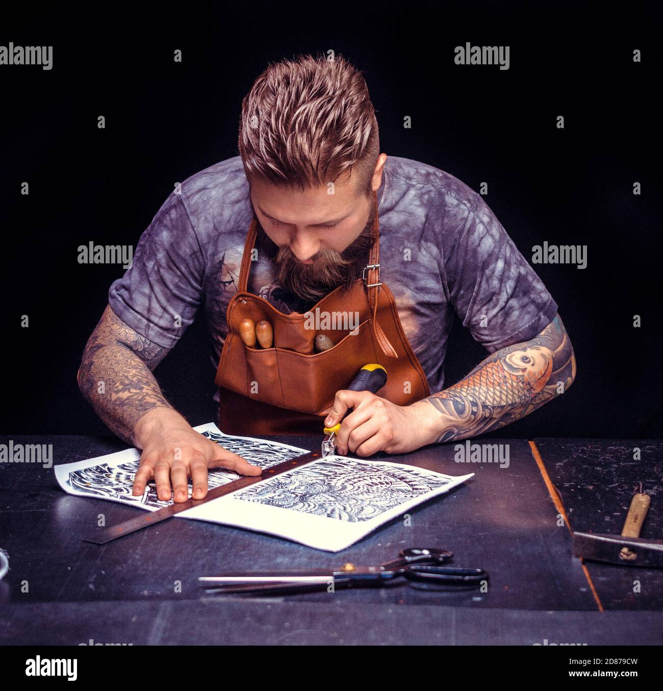 Leather workman manufacturing new leather product at the leather studio ...