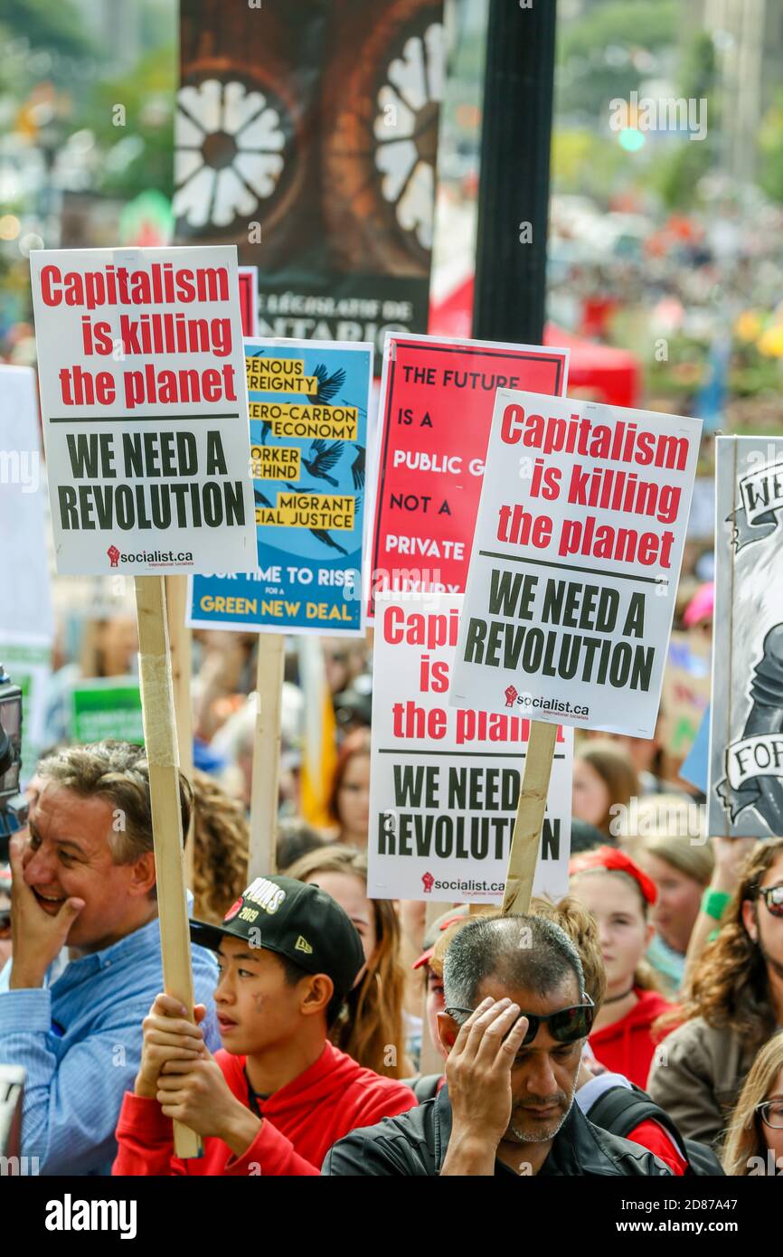 Protesters hold placards expressing their opinions during the ...