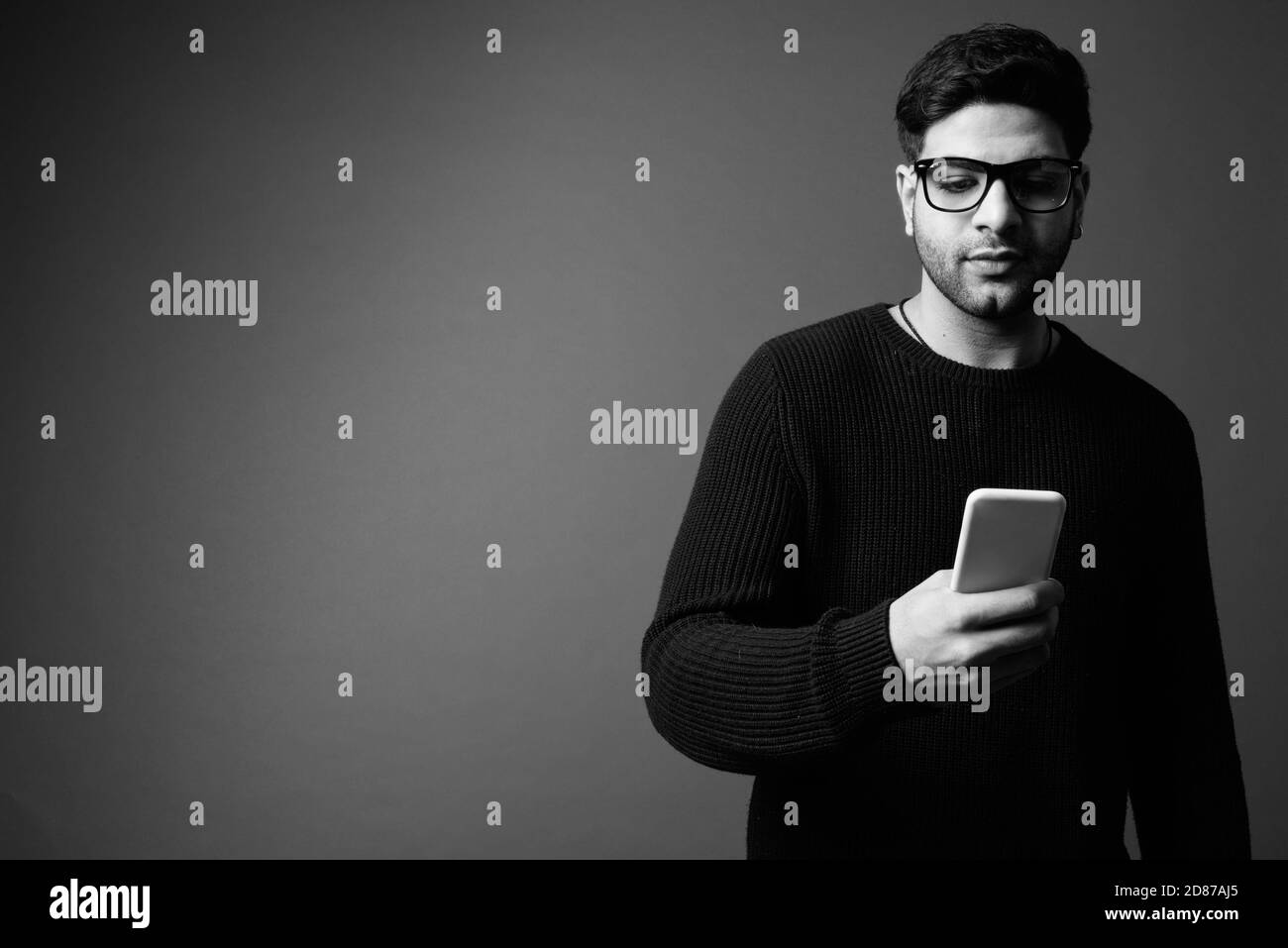 Young man beard holding glasses Black and White Stock Photos & Images ...