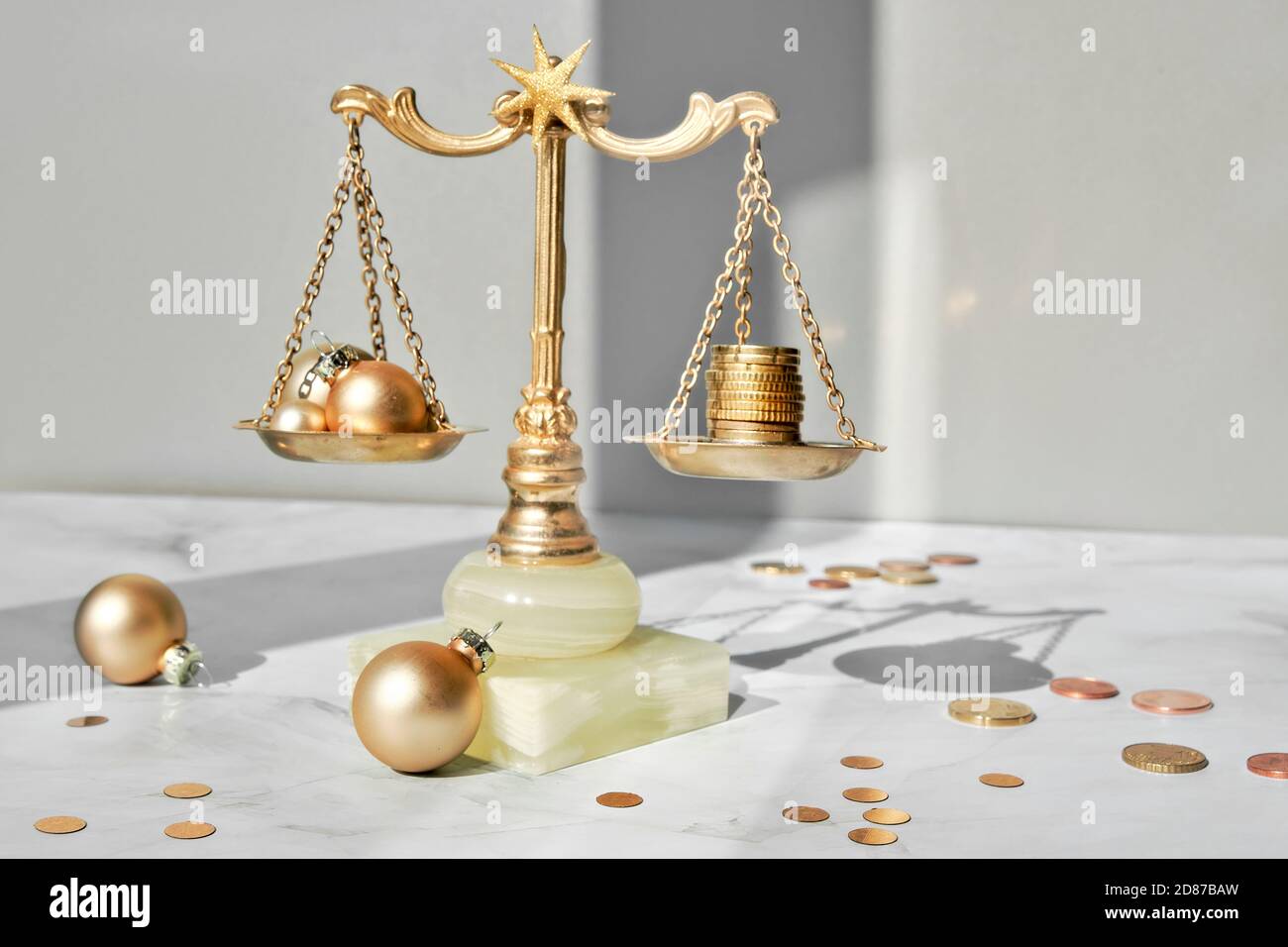 Balance scales with coins hi-res stock photography and images - Alamy
