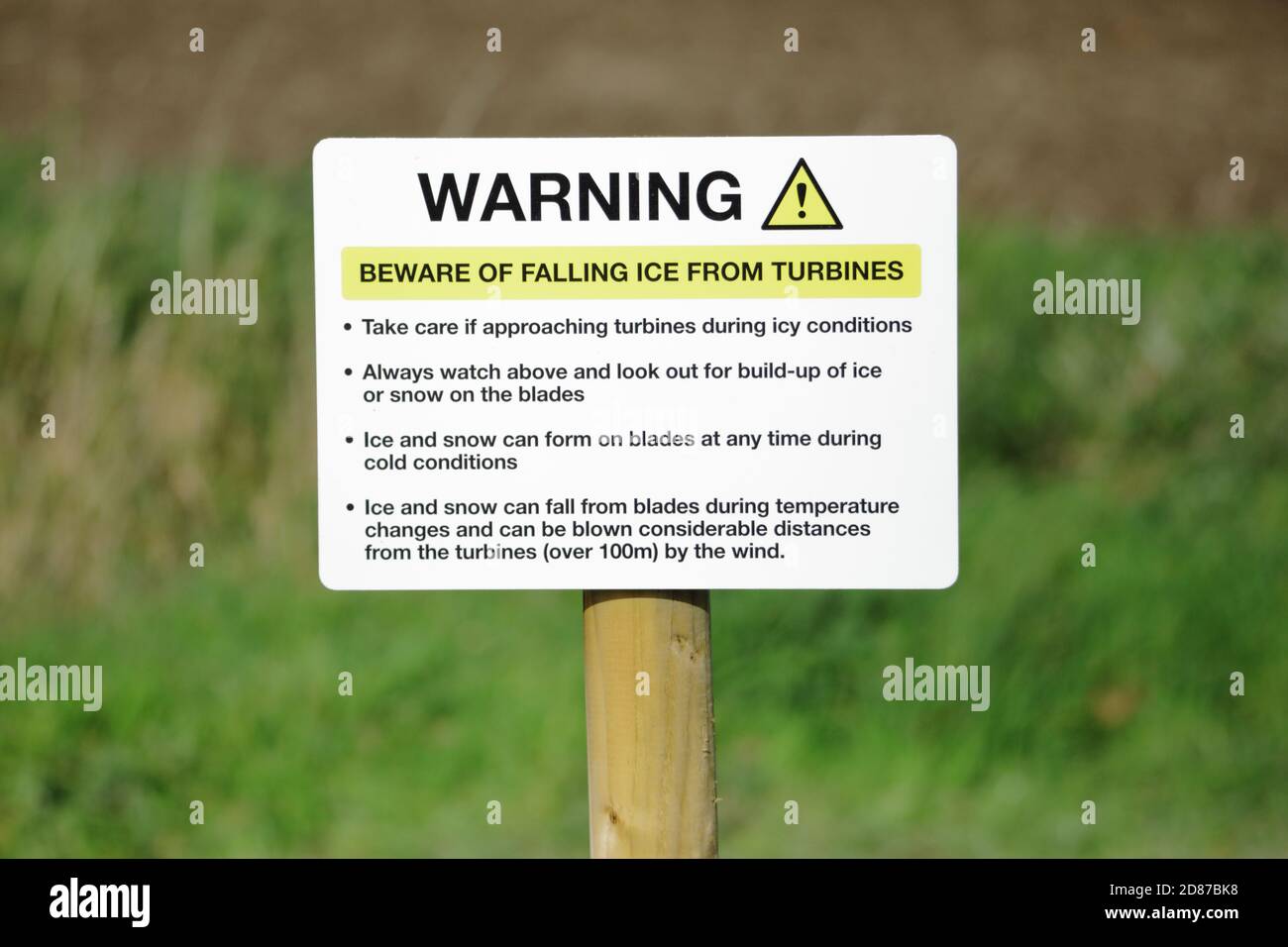 an Ice warning sign by the side of wind turbines Stock Photo - Alamy