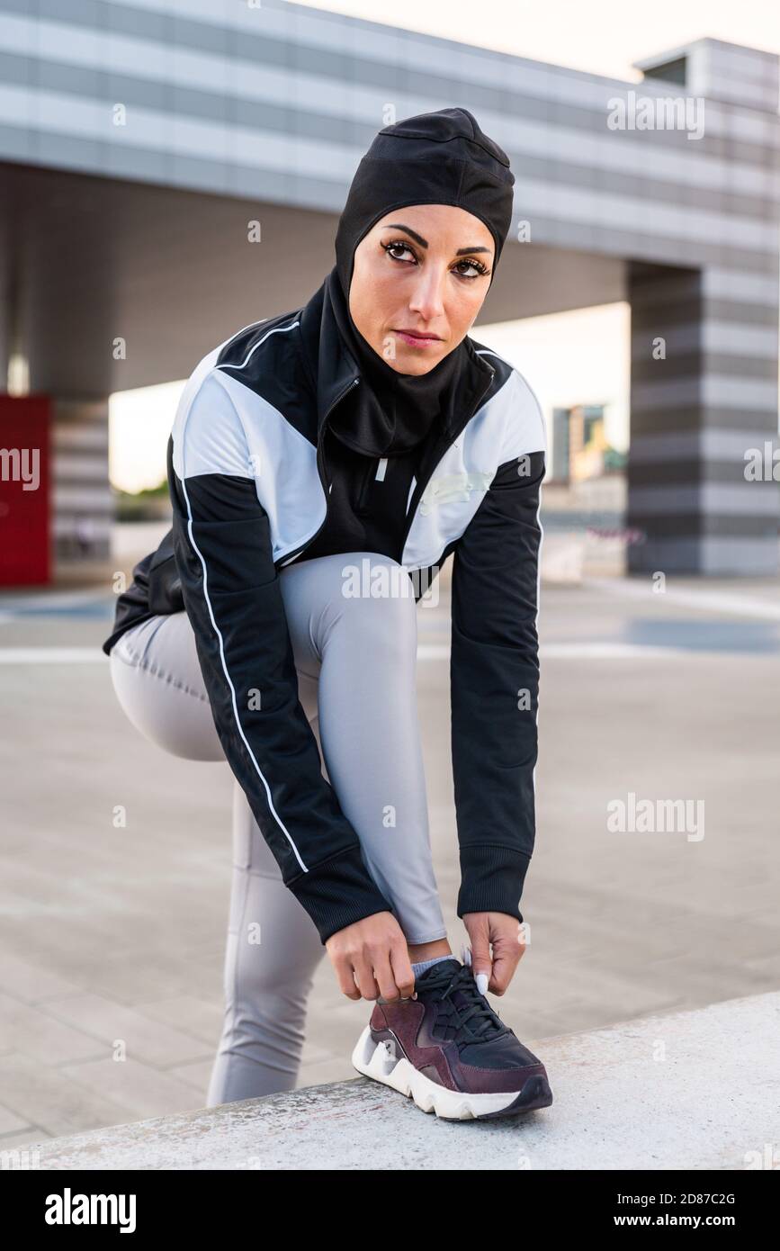 Muslim sportive girl with fit body training outside - Beautiful woman ...