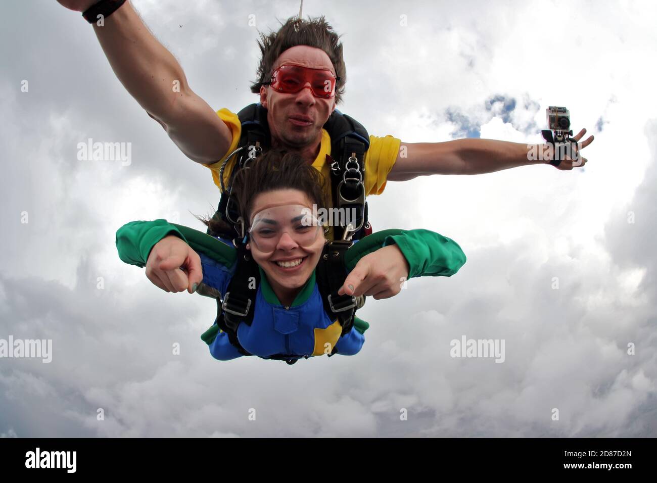 Skydiving tandem happiness on a cloudy day Stock Photo - Alamy