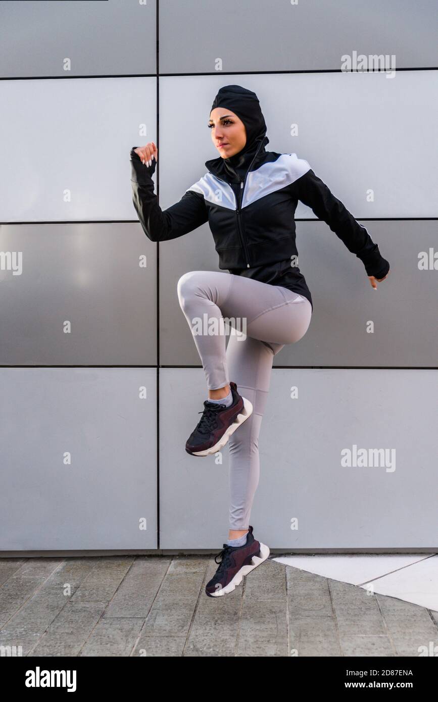 Muslim sportive girl with fit body training outside - Beautiful woman ...