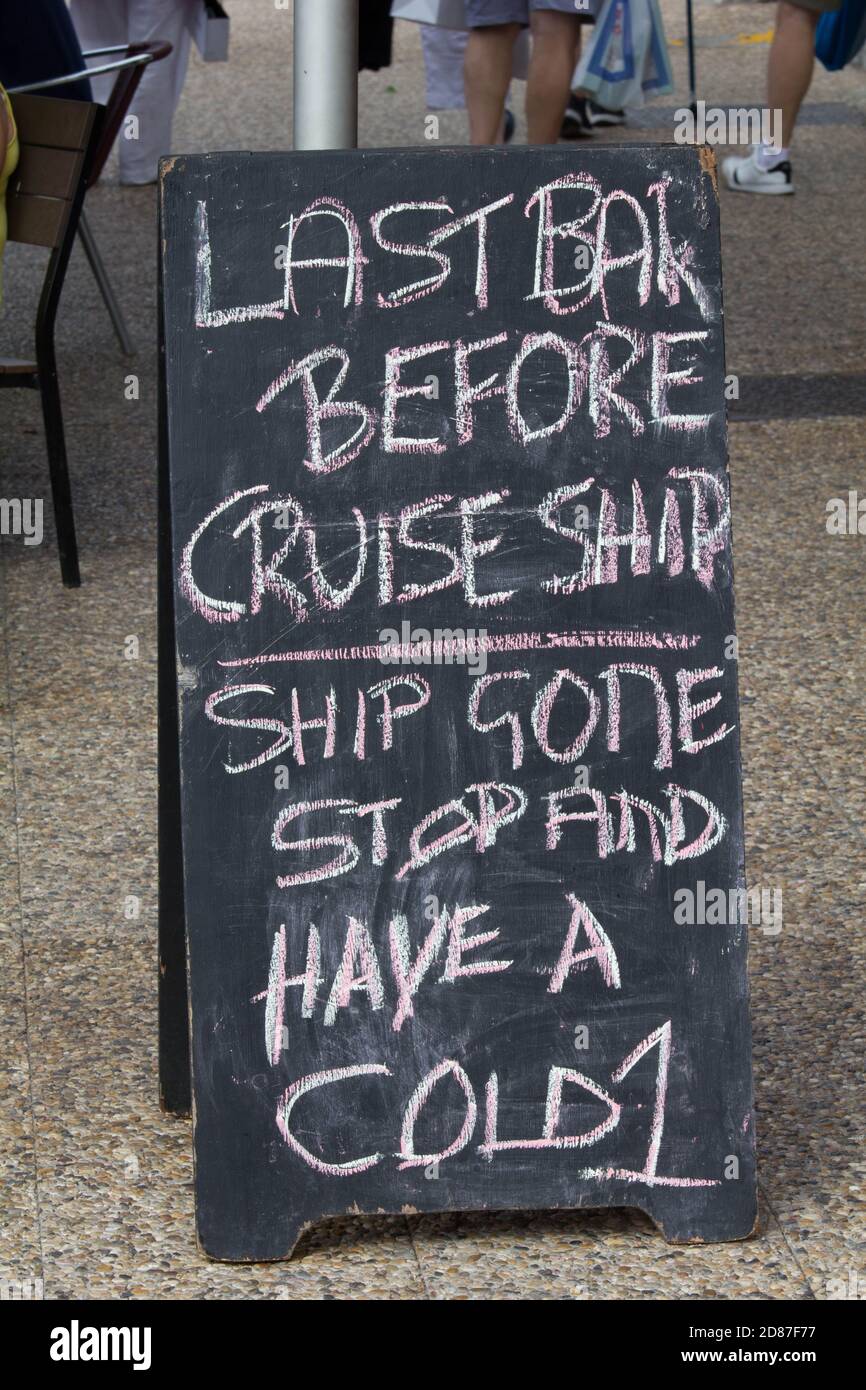 Sign advertising the last bar and cold drinks for pedestrians walking ...