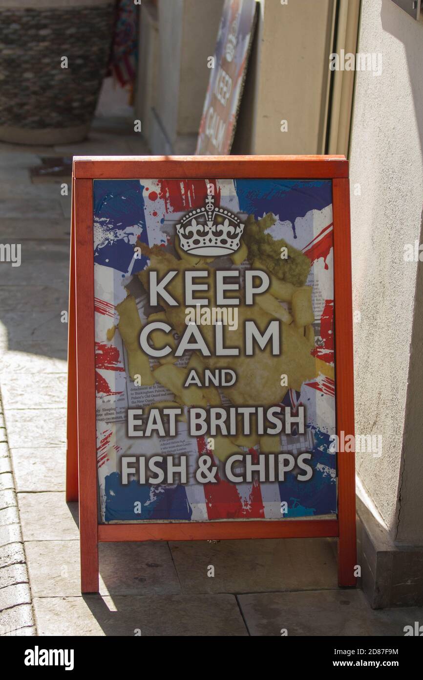 Sign advertising fish and chips in Gibraltar's Main Street Stock Photo ...