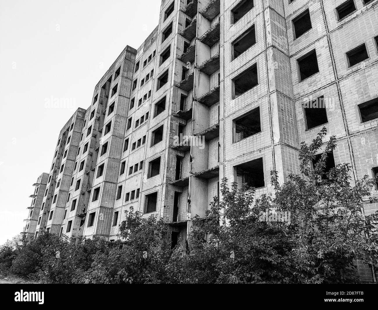 High multistorey abandoned soviet building facade with crashed ...