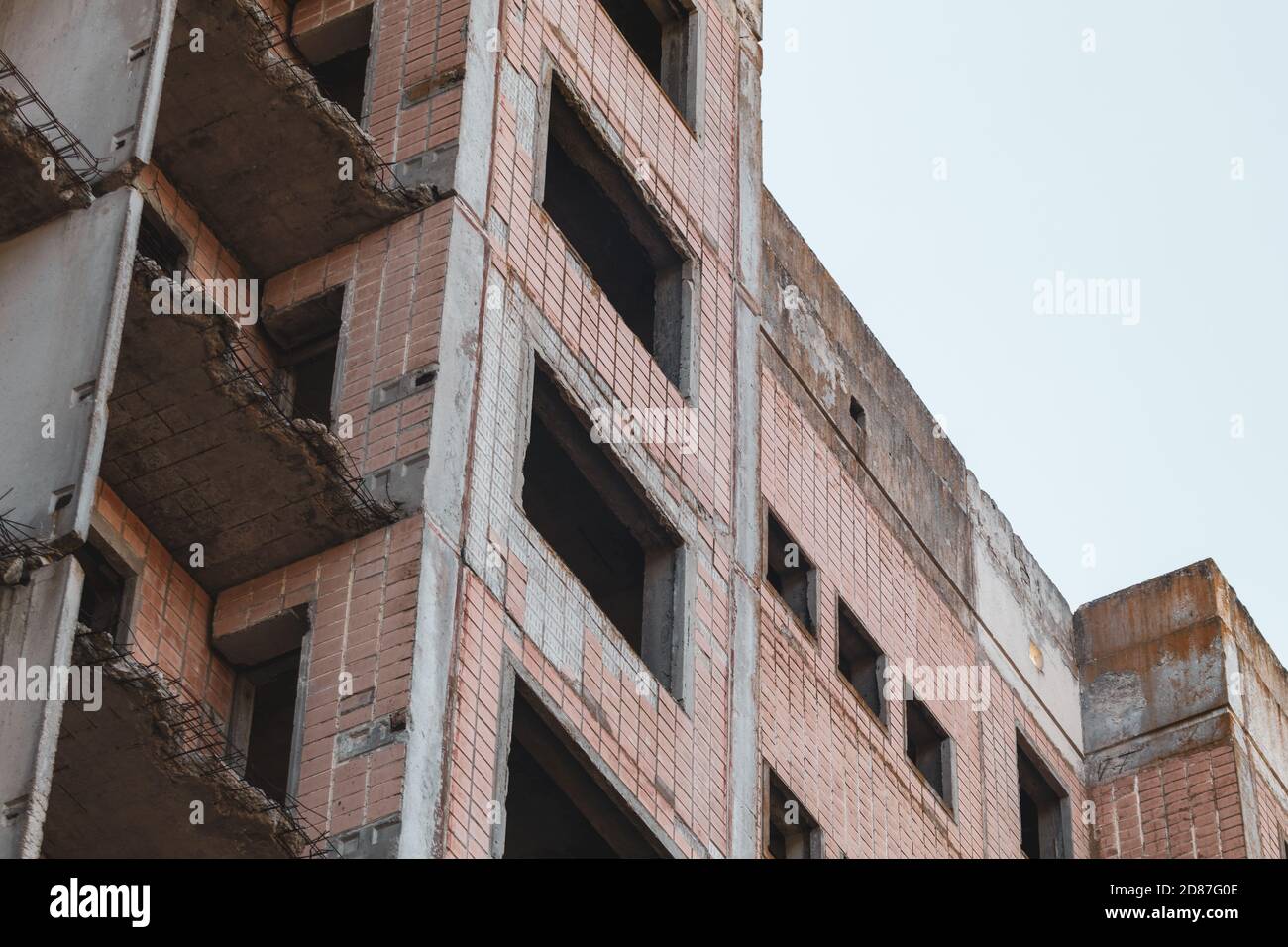 High multistorey abandoned soviet building facade with crashed ...