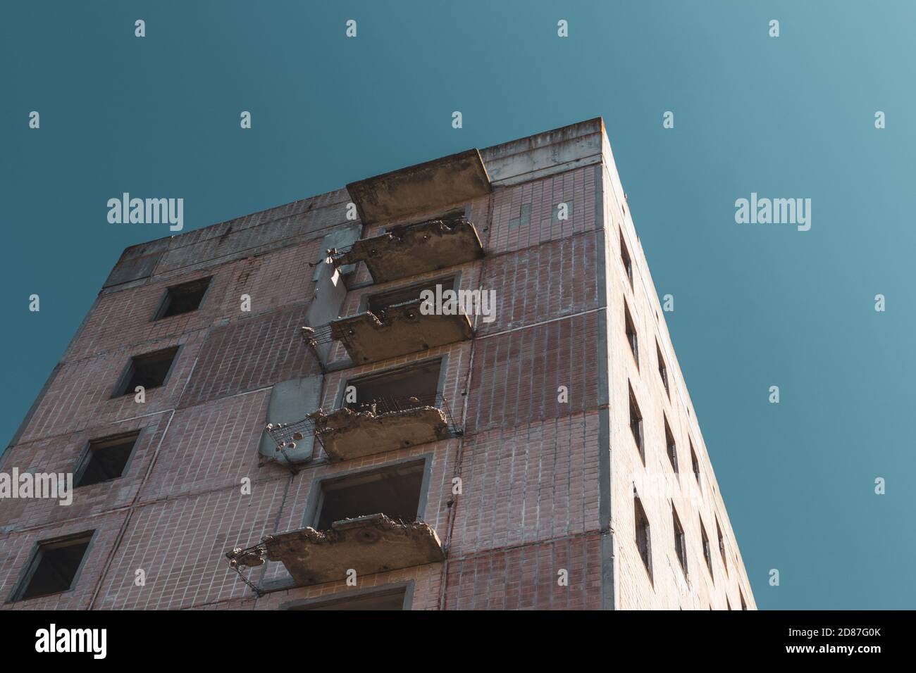 High multistorey abandoned soviet building facade top corner. Weathered ...
