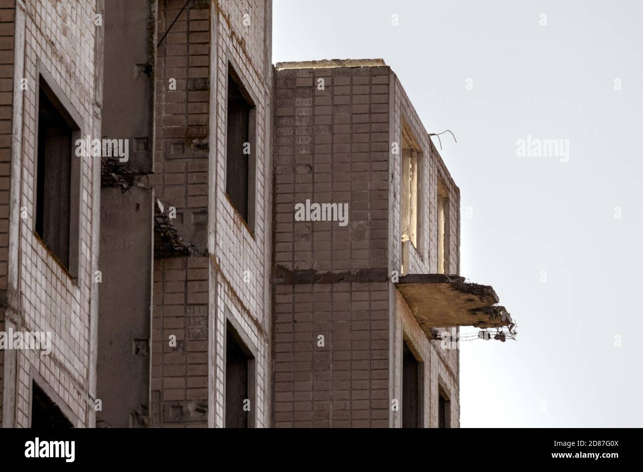 High multistorey abandoned soviet building facade with crashed ...
